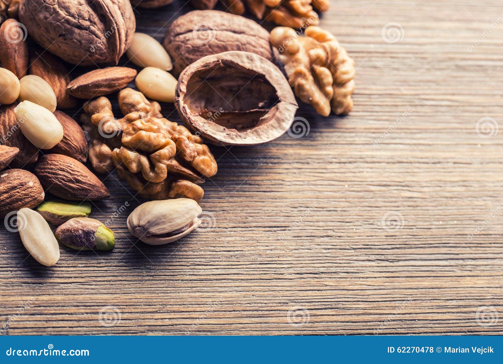 Almonds, Walnuts and Hazelnuts on Wooden Table. Stock Photo - Image of ...