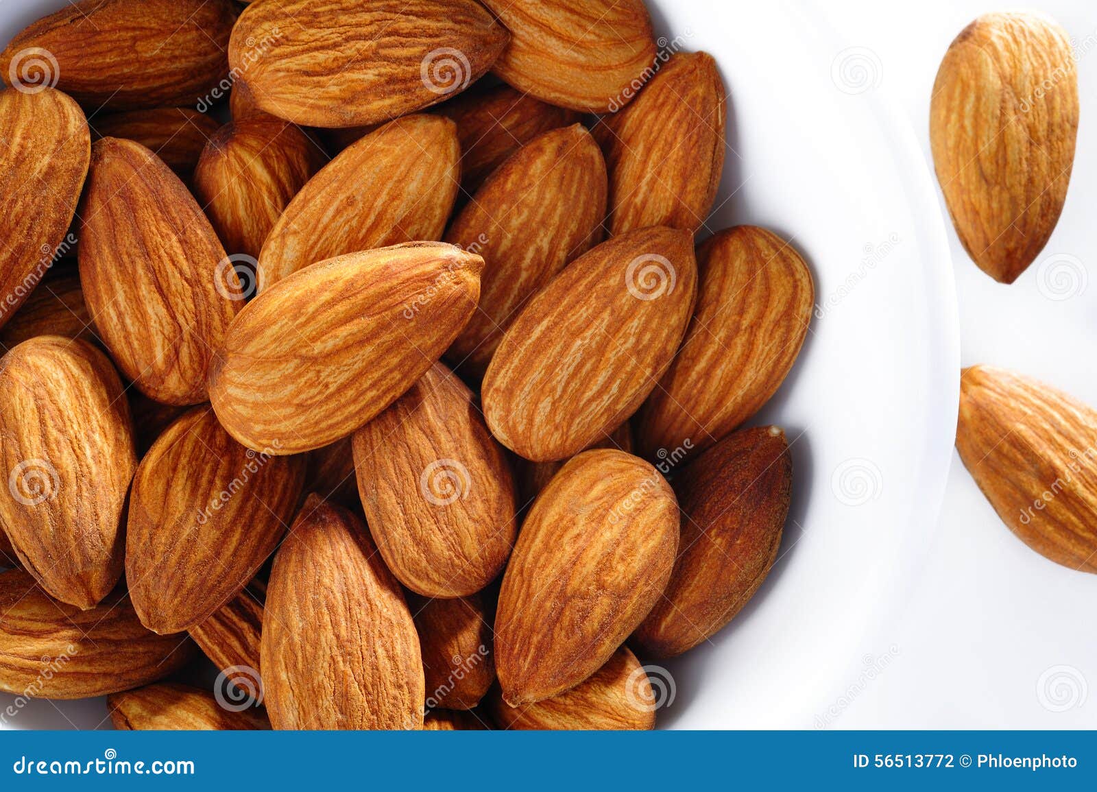 Almonds in white bowl stock photo. Image of ingredient - 56513772