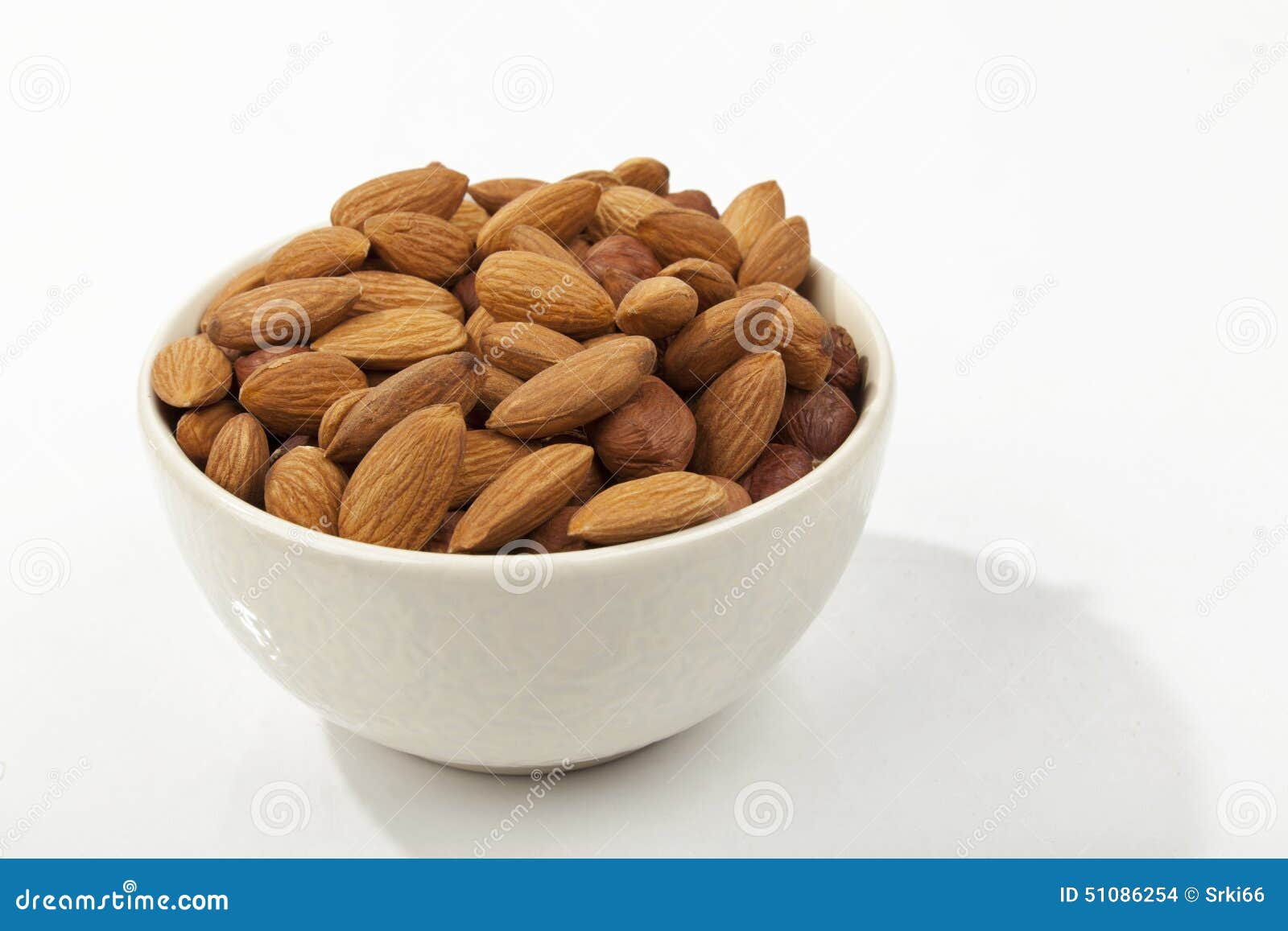 Almonds in a white bowl stock photo. Image of organic - 51086254
