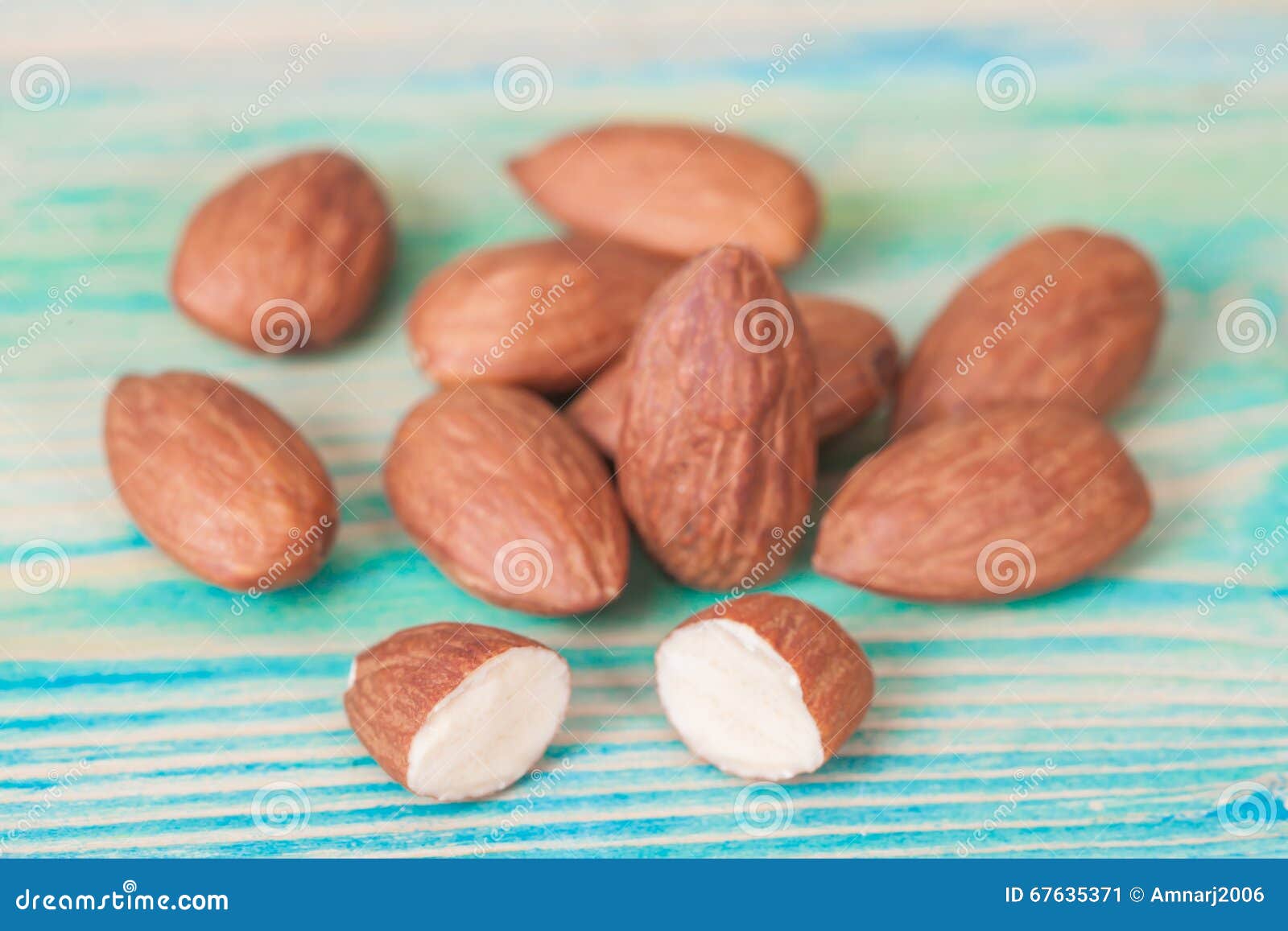 Almonds on wood stock image. Image of group, color, almond - 67635371