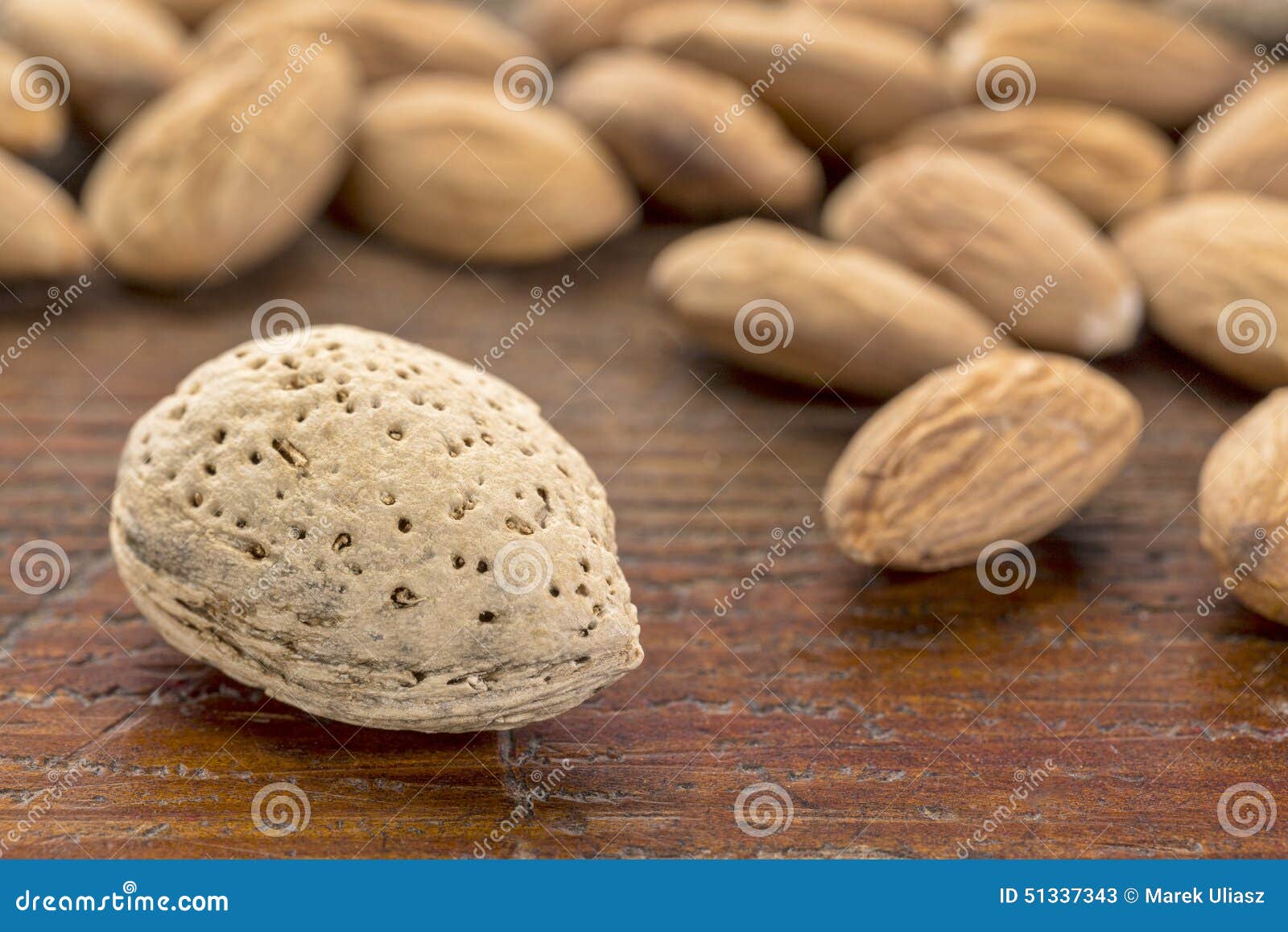Almonds on wood table stock image. Image of rustic, almond - 51337343