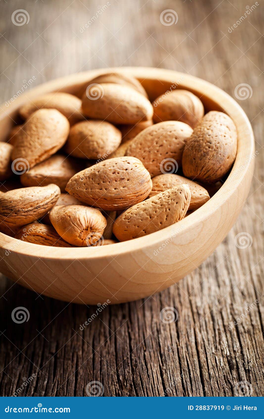 Almonds in wooden bowl stock image. Image of fresh, edible - 28837919