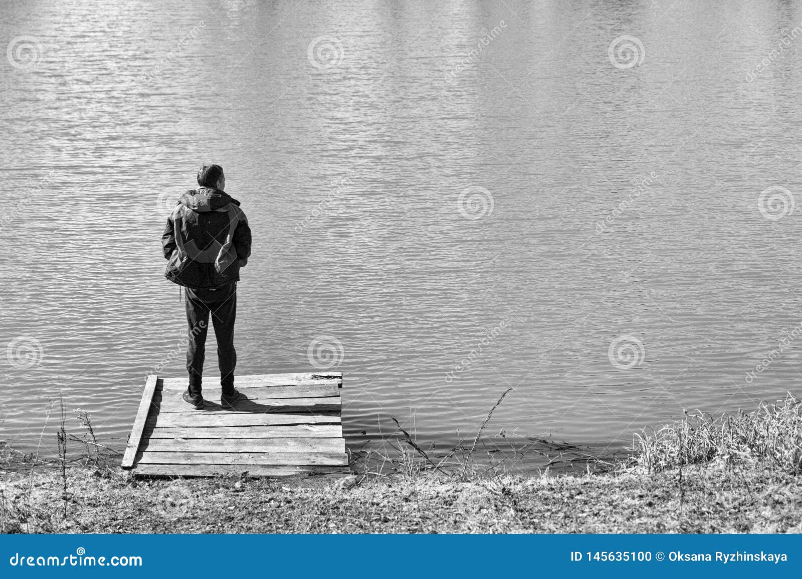 Alone Man Standing on the Edge and Staring at Lake. Back View Stock ...
