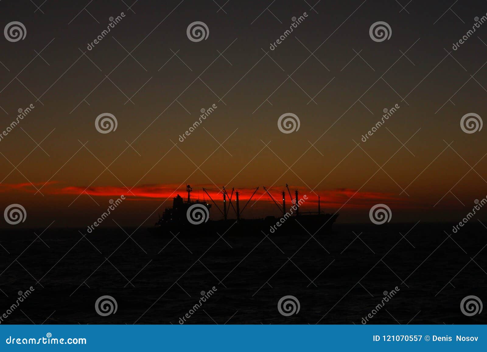 Ship in the Ocean and Red Cloud Under it Stock Image - Image of clouds ...