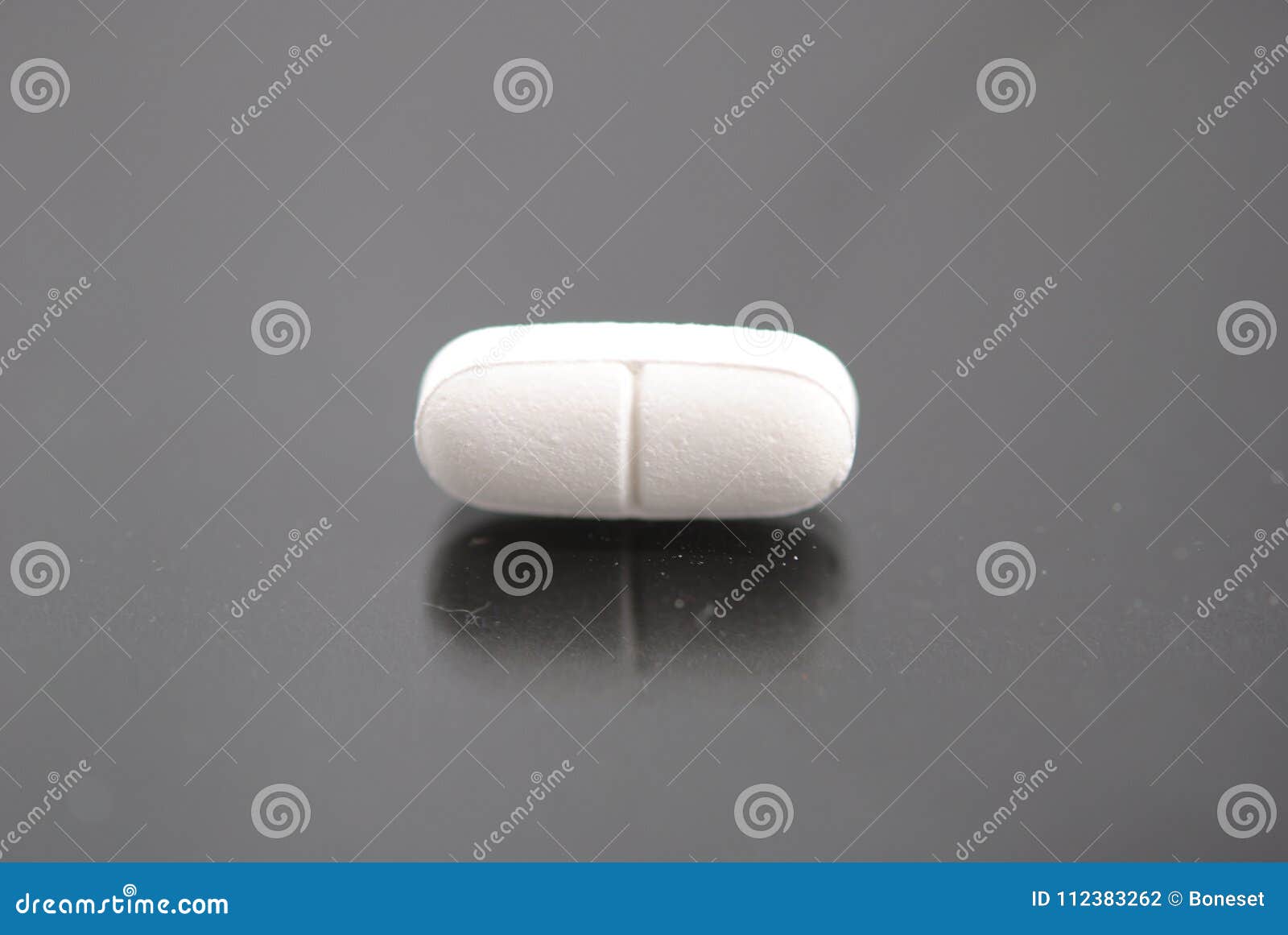 Alone white oval tablet stock photo. Image of back, bright - 112383262