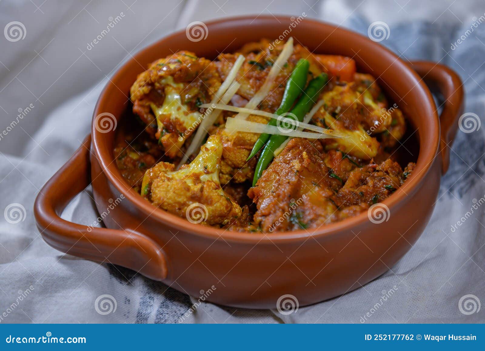 Aloo Gobi and Spring Onion Served in a Dish Isolated on Dark Background ...