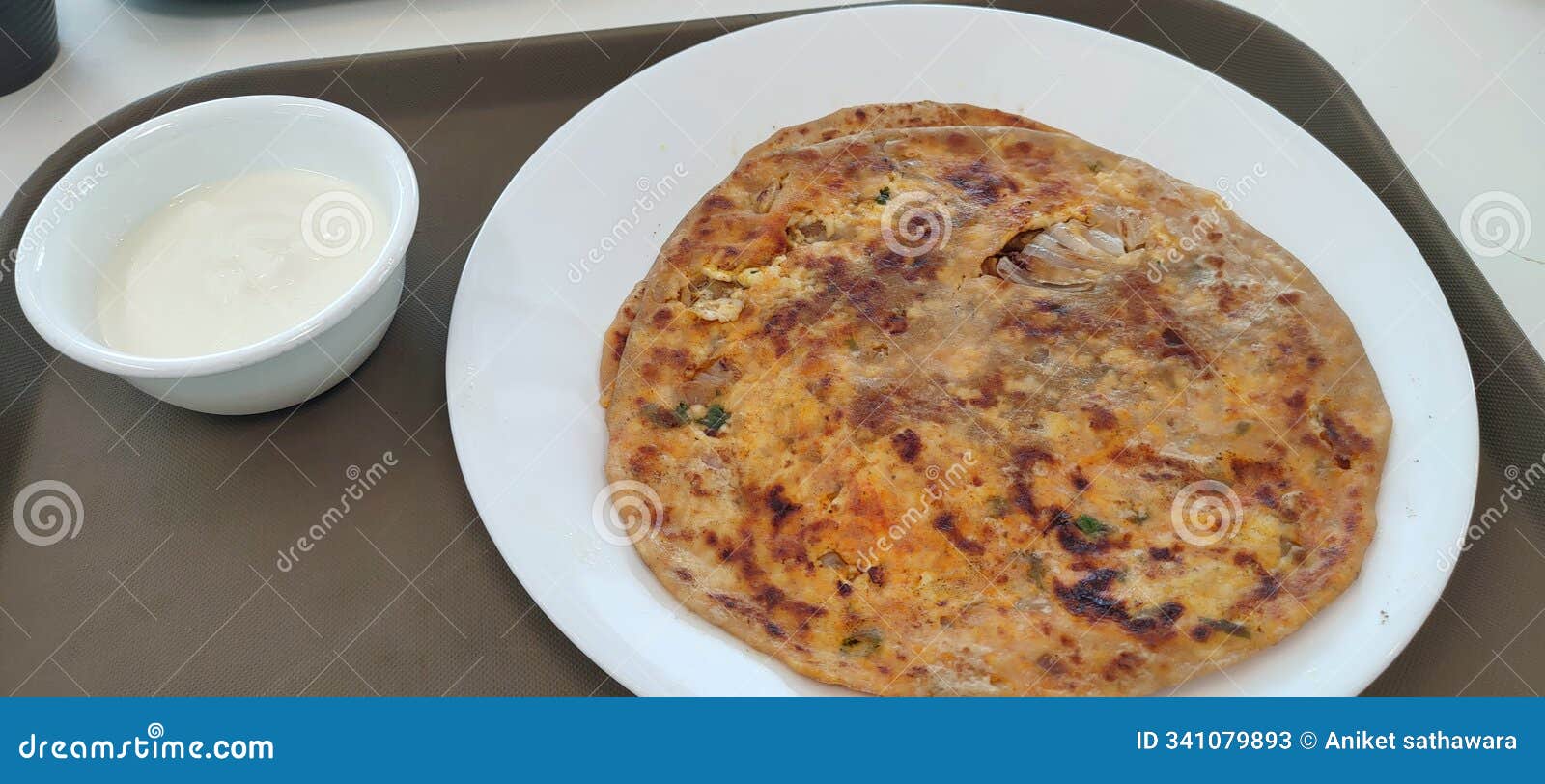 Aloo Paratha With Curd Served On Plate. Traditional North Indian Food ...