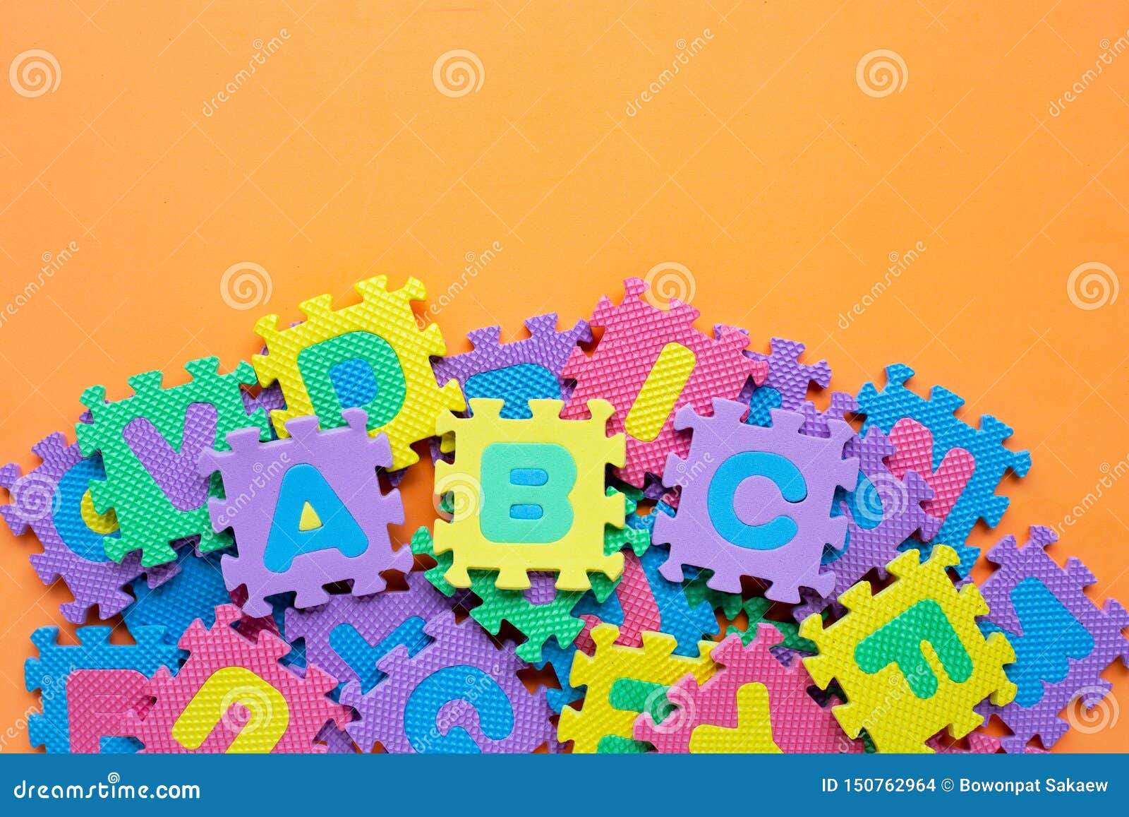 Alphabet Puzzle on Orange Background Stock Photo - Image of isolated ...