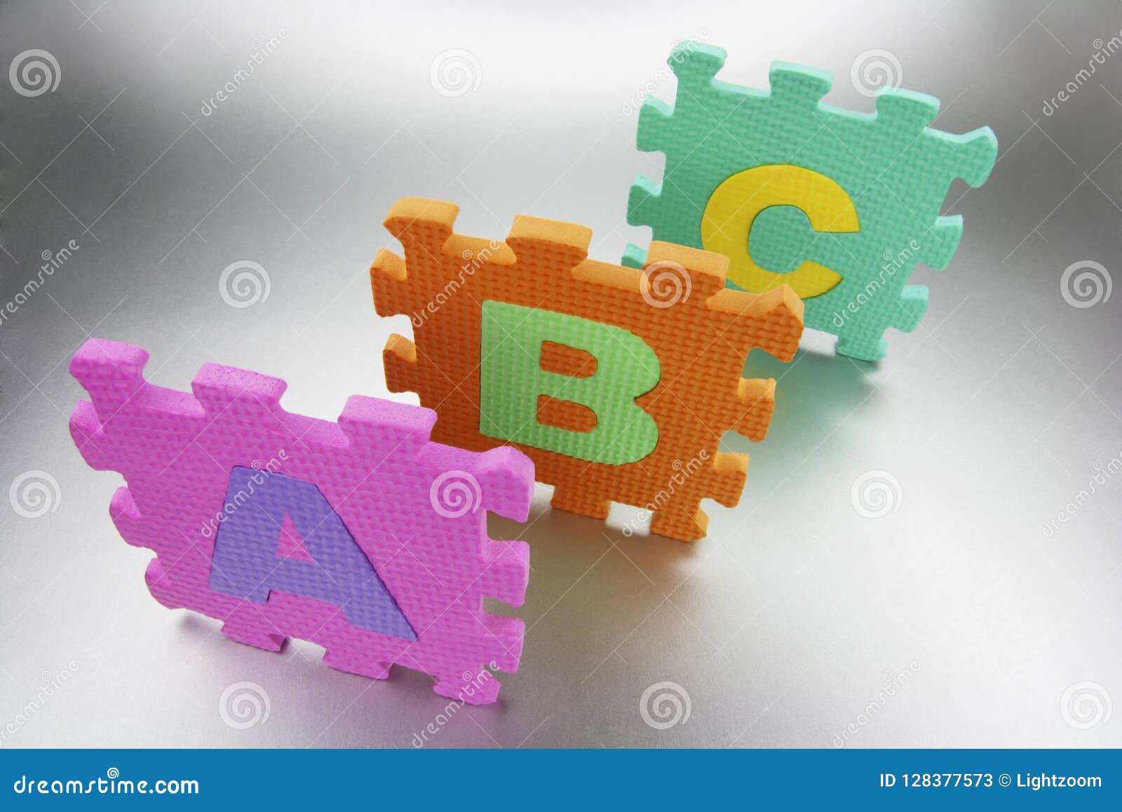 Alphabet Puzzles stock image. Image of learning, activity - 128377573