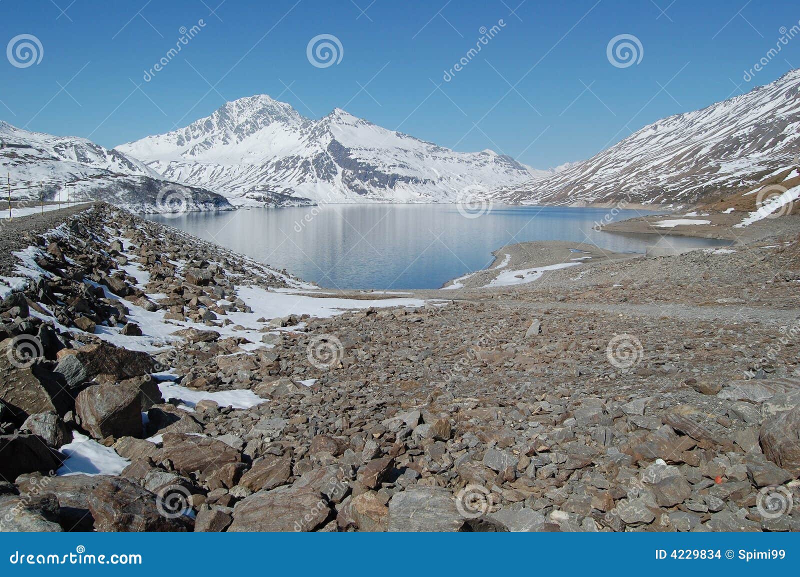 Alpine lake and dam stock photo. Image of mountain, stone - 4229834