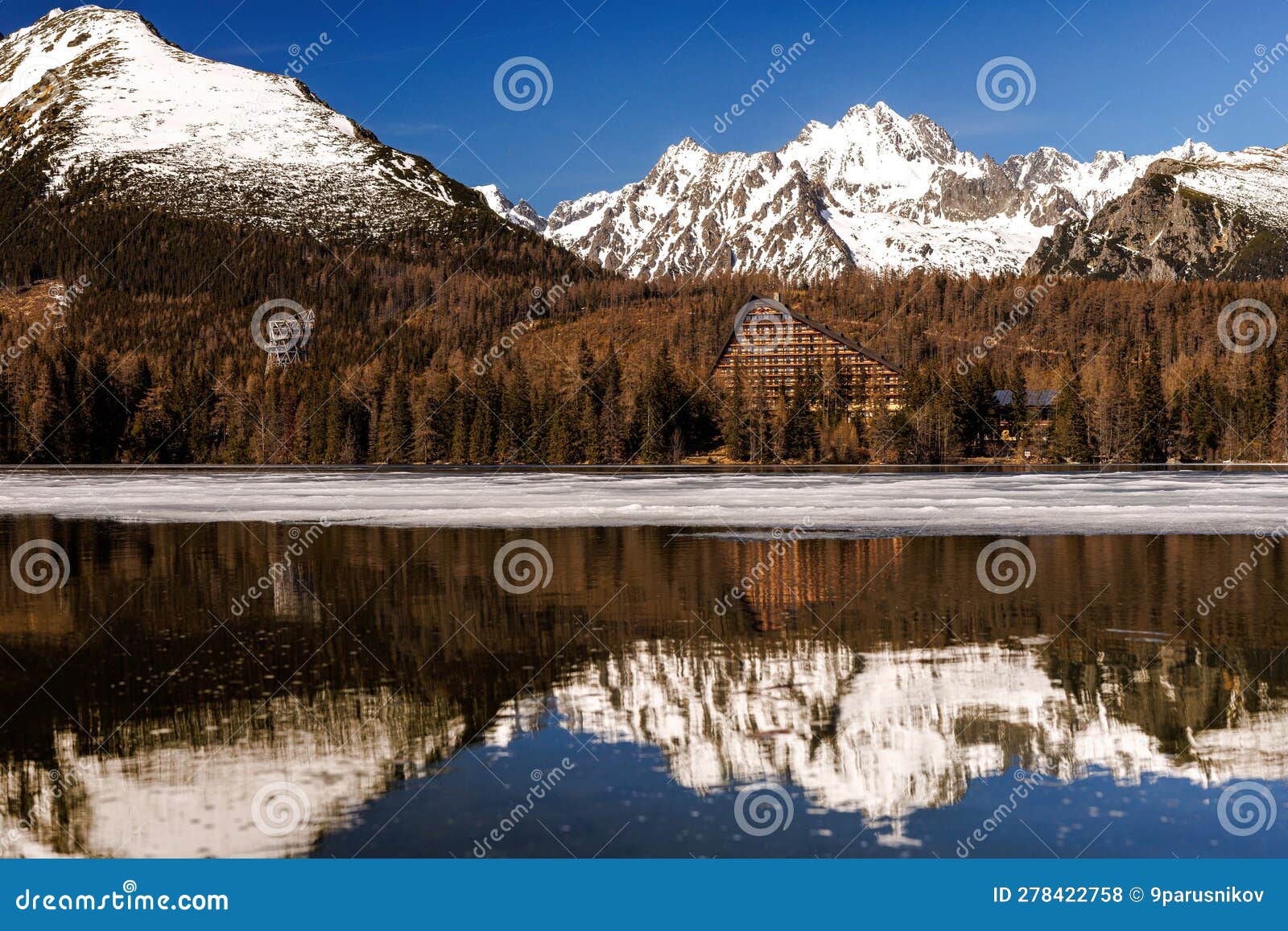 Alpine Lake with a Snowy Mountain Backdrop. Stock Photo - Image of ...