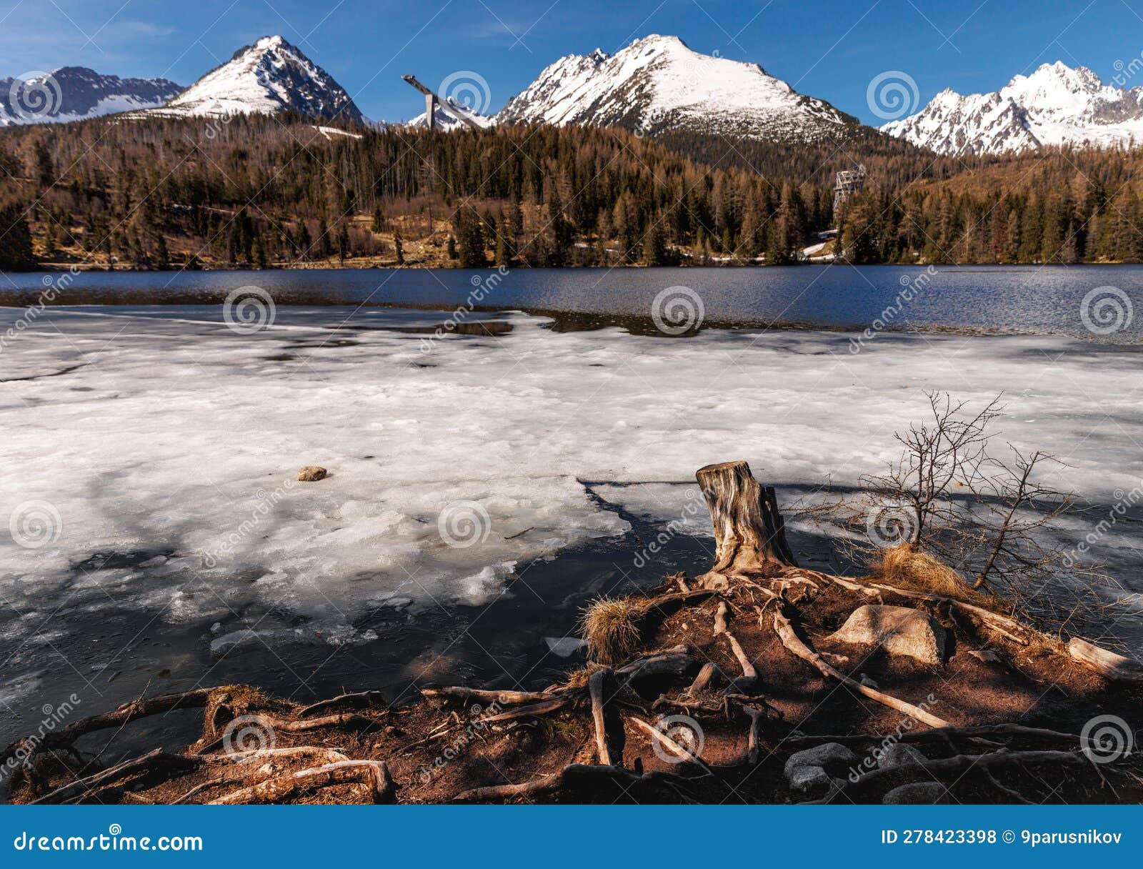 Alpine Lake with a Snowy Mountain Backdrop. Stock Photo - Image of ...