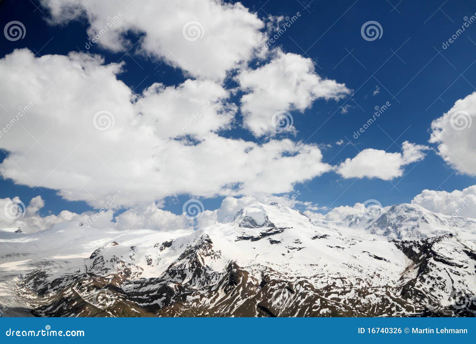 Alpine snowy mountains stock photo. Image of clouds, rocky - 16740326