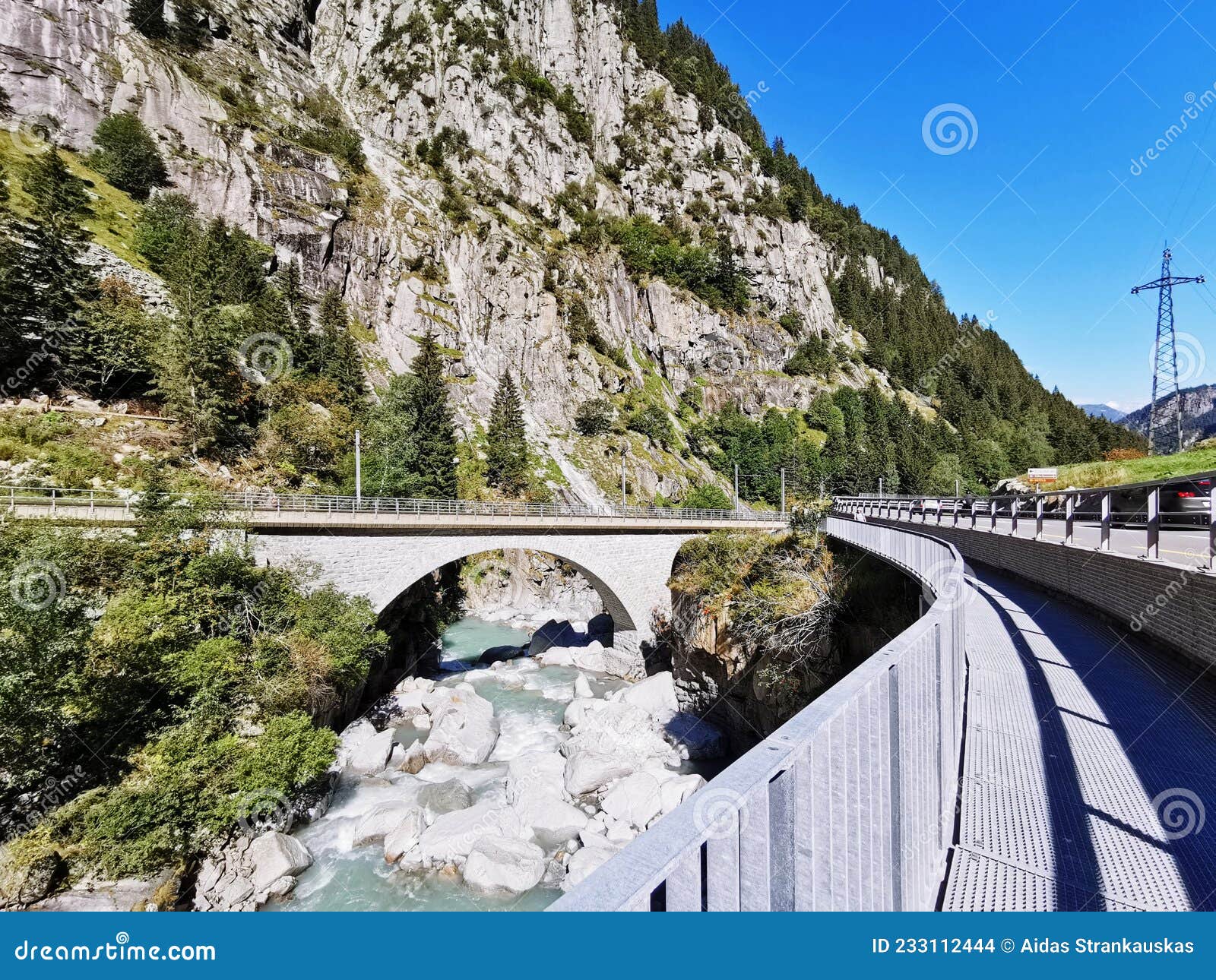 Alpine Valley with a Bridge and Mountains in Background Stock Photo ...
