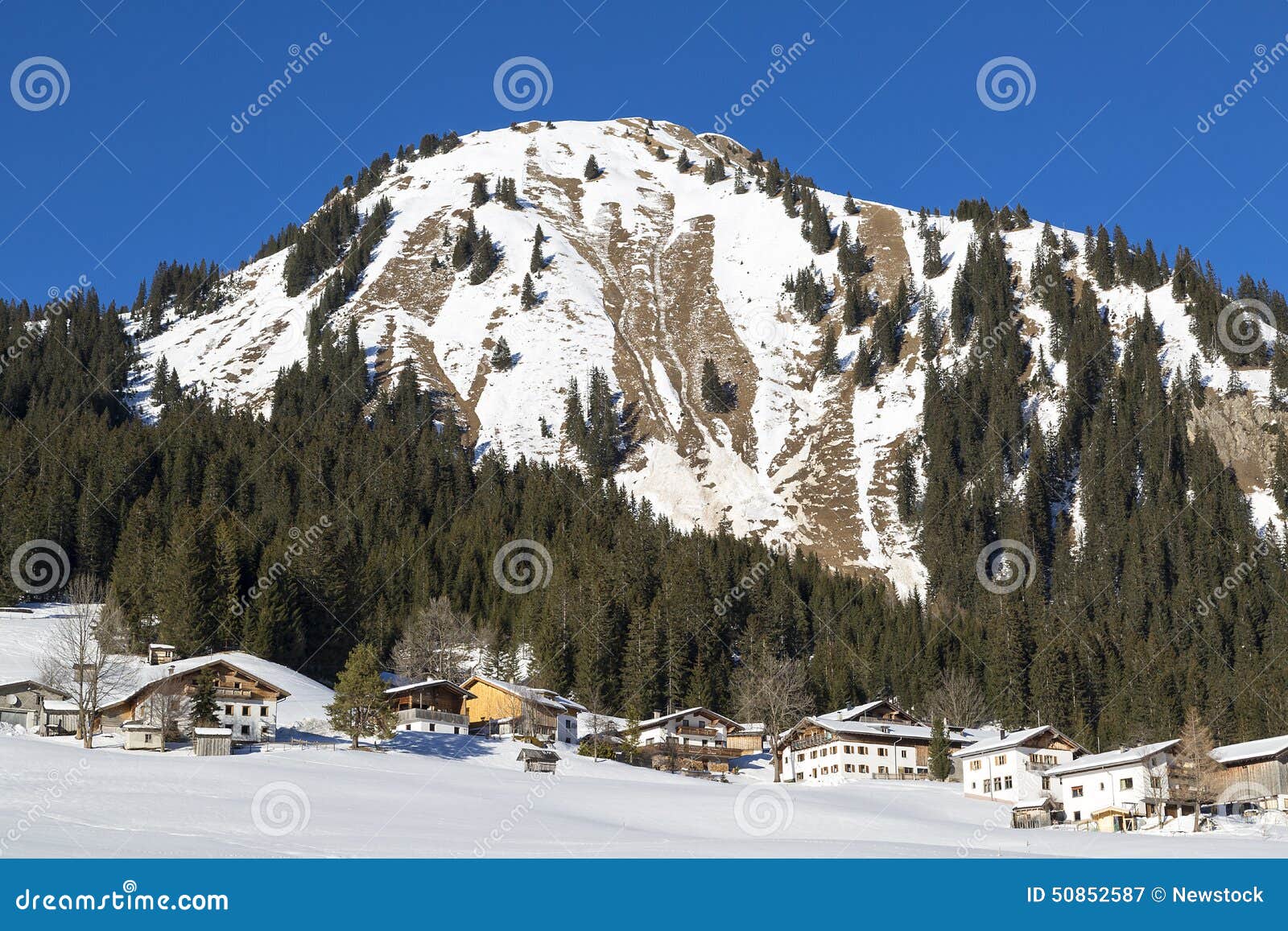 Alpine village in the snow stock image. Image of europe - 50852587