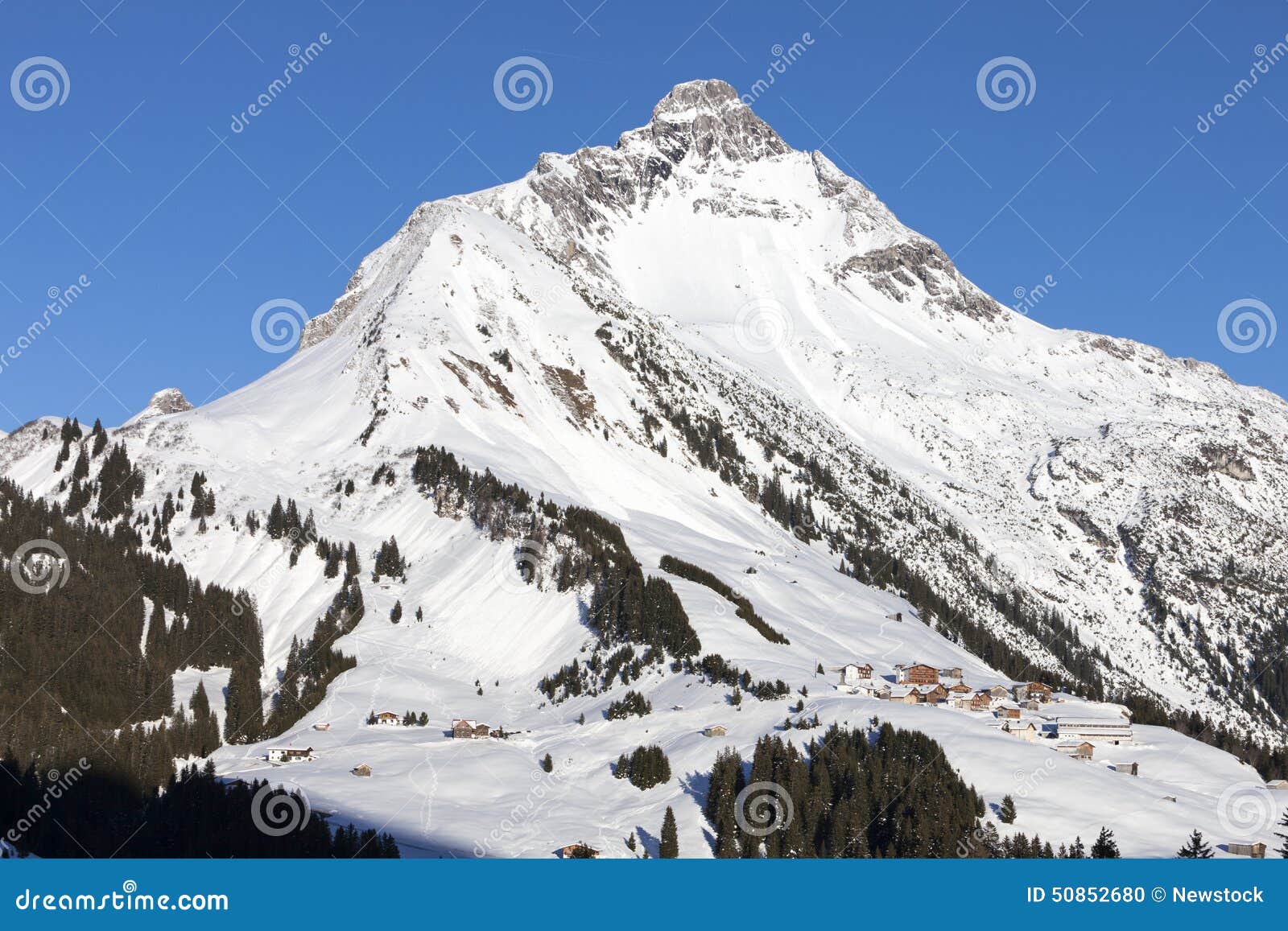 Alpine village in the snow stock photo. Image of mountain - 50852680