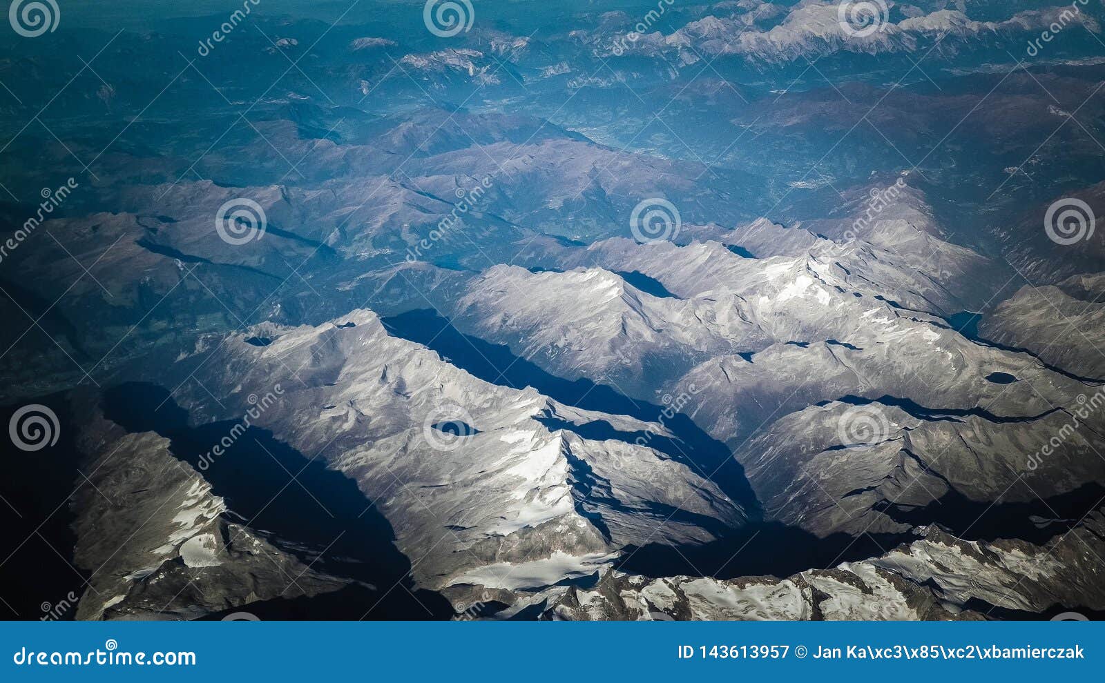 Alps from plane window stock image. Image of travel - 143613957