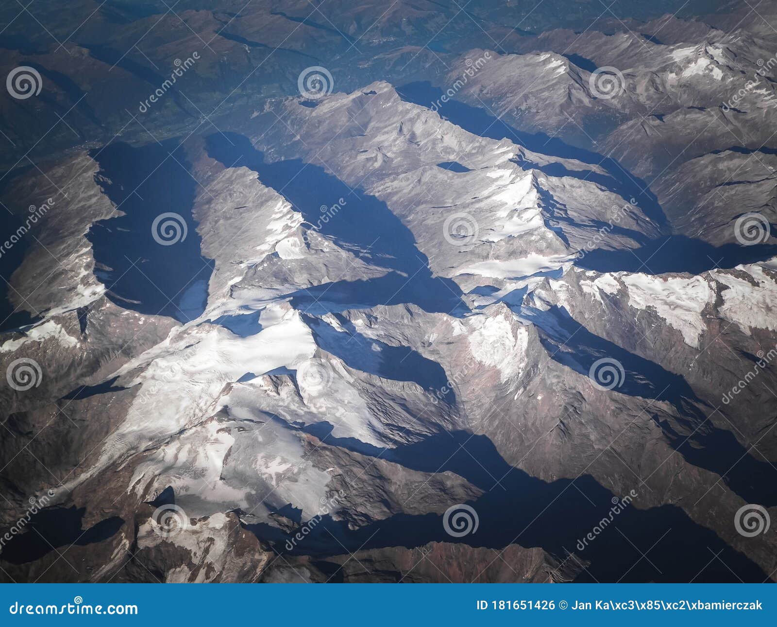 Alps from plane window stock photo. Image of travsport - 181651426