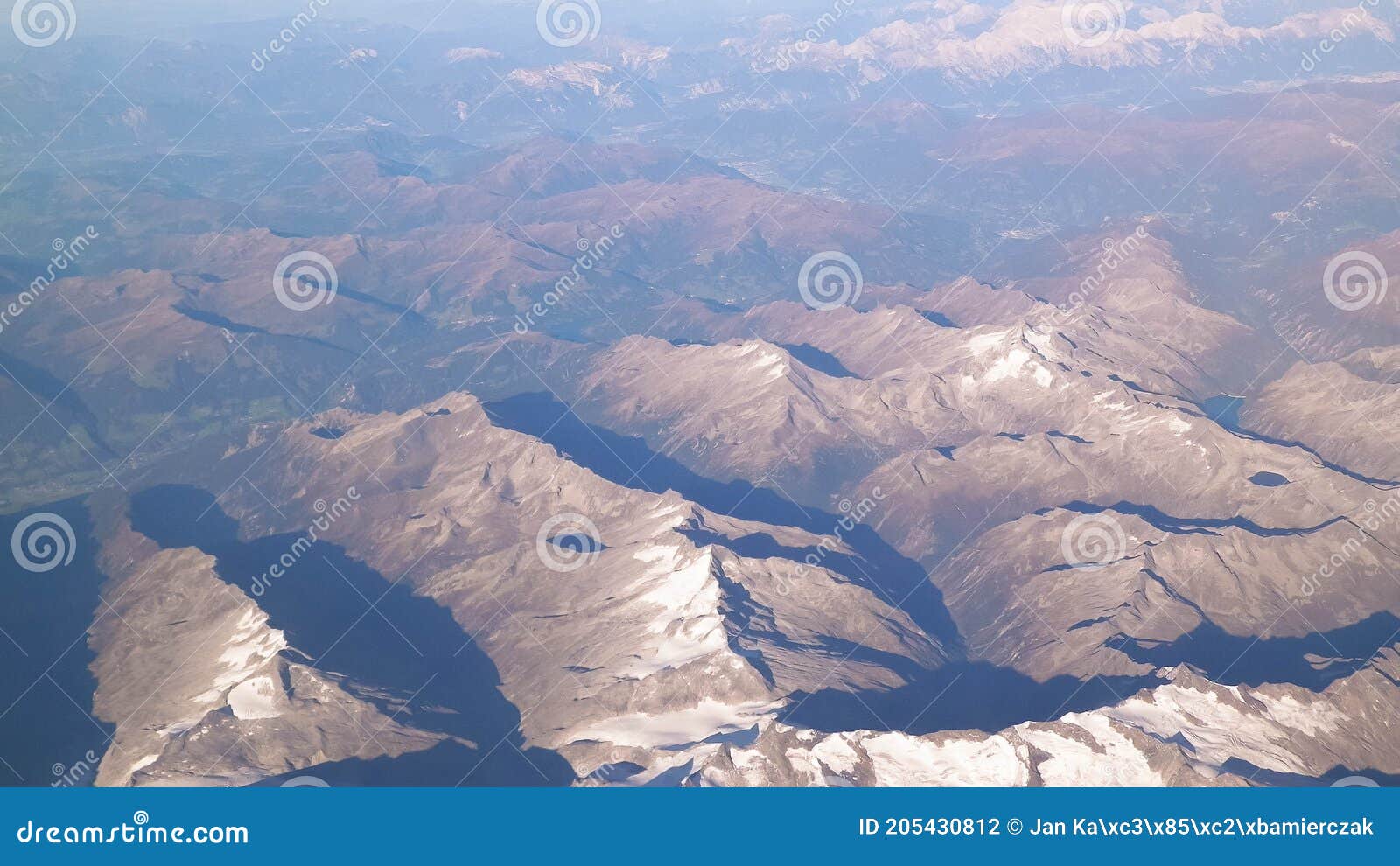 Alps from plane window stock photo. Image of travsport - 205430812