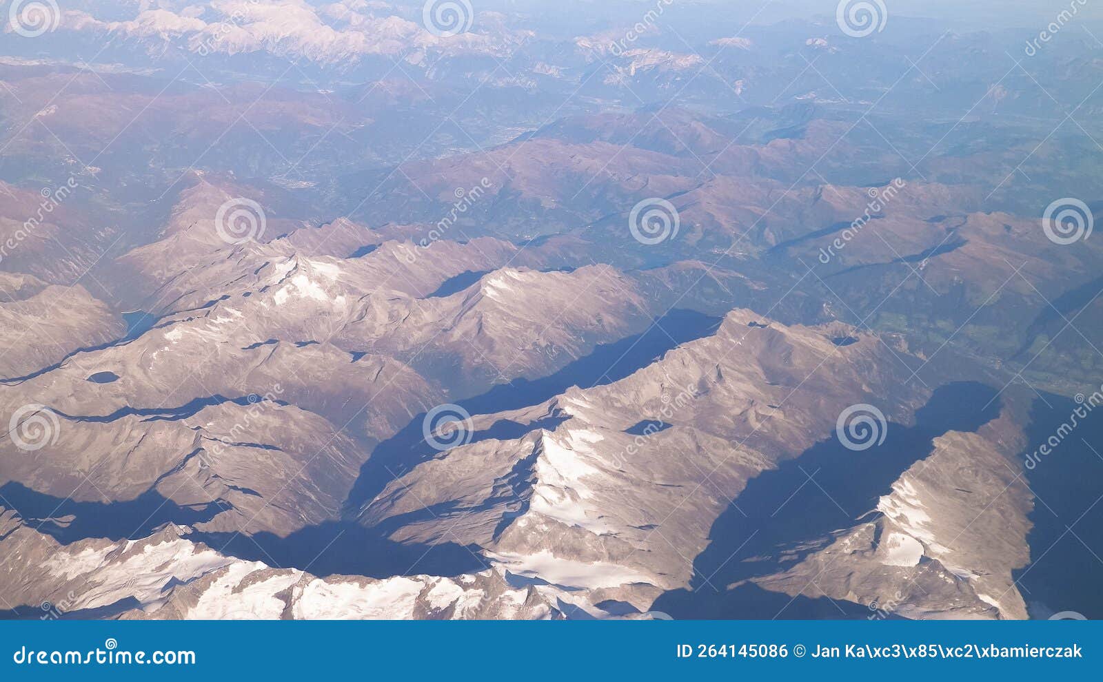 Alps from plane window stock photo. Image of alpen, alps - 264145086