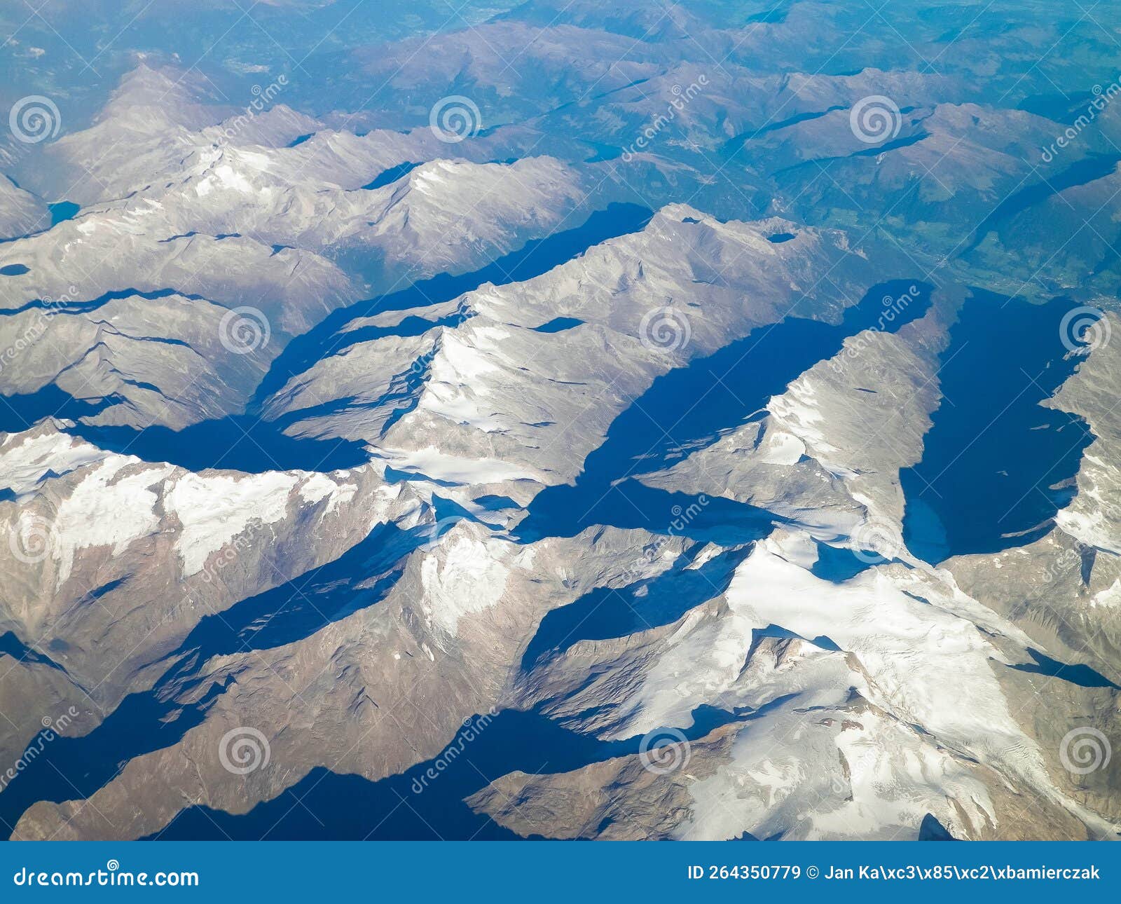 Alps from plane window stock image. Image of environment - 264350779
