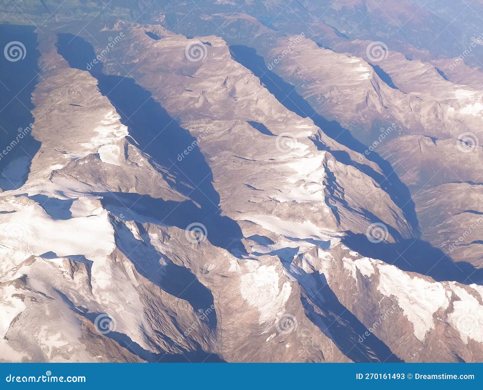 Alps from plane window stock image. Image of window - 270161493