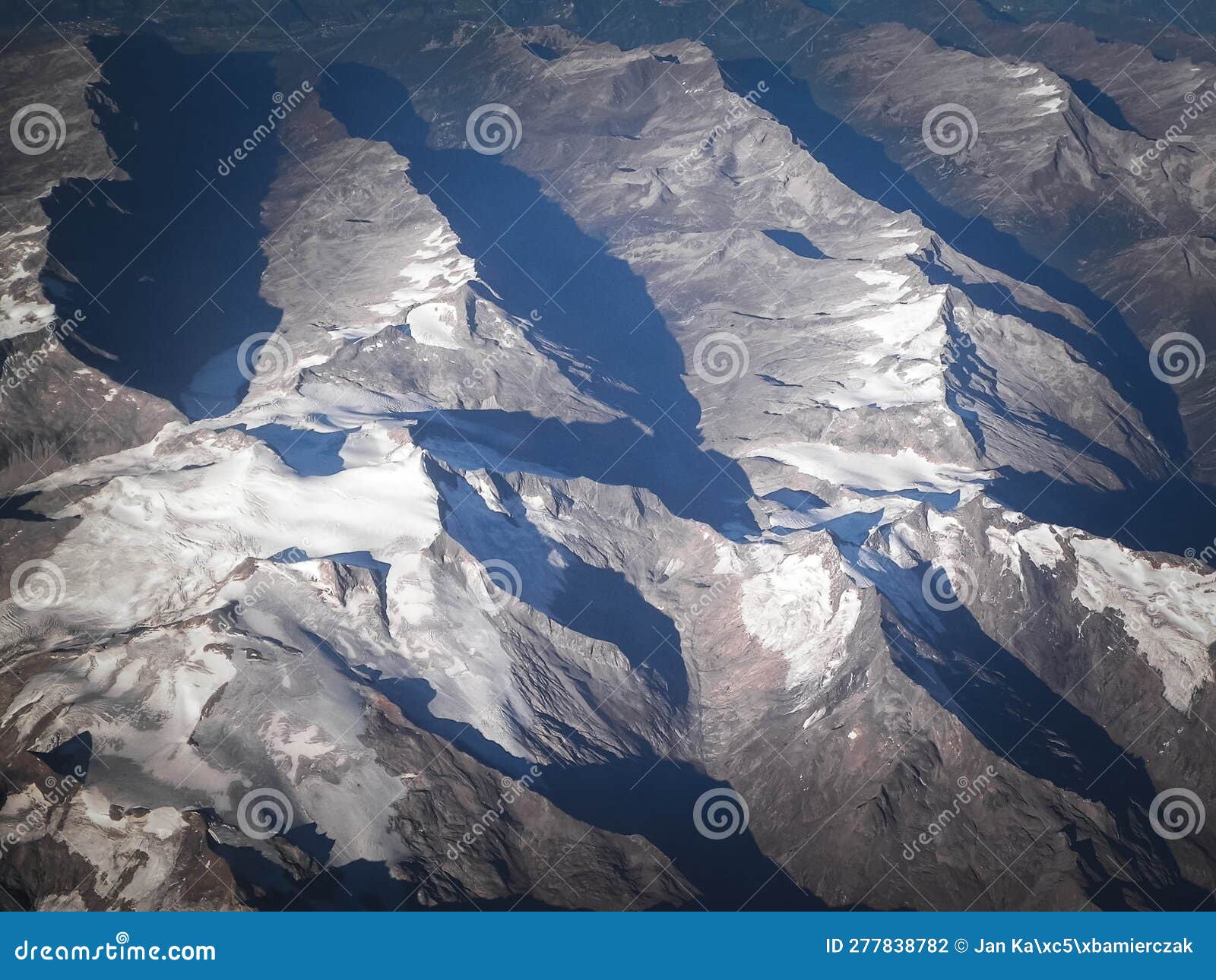 Alps from plane window stock photo. Image of environment - 277838782