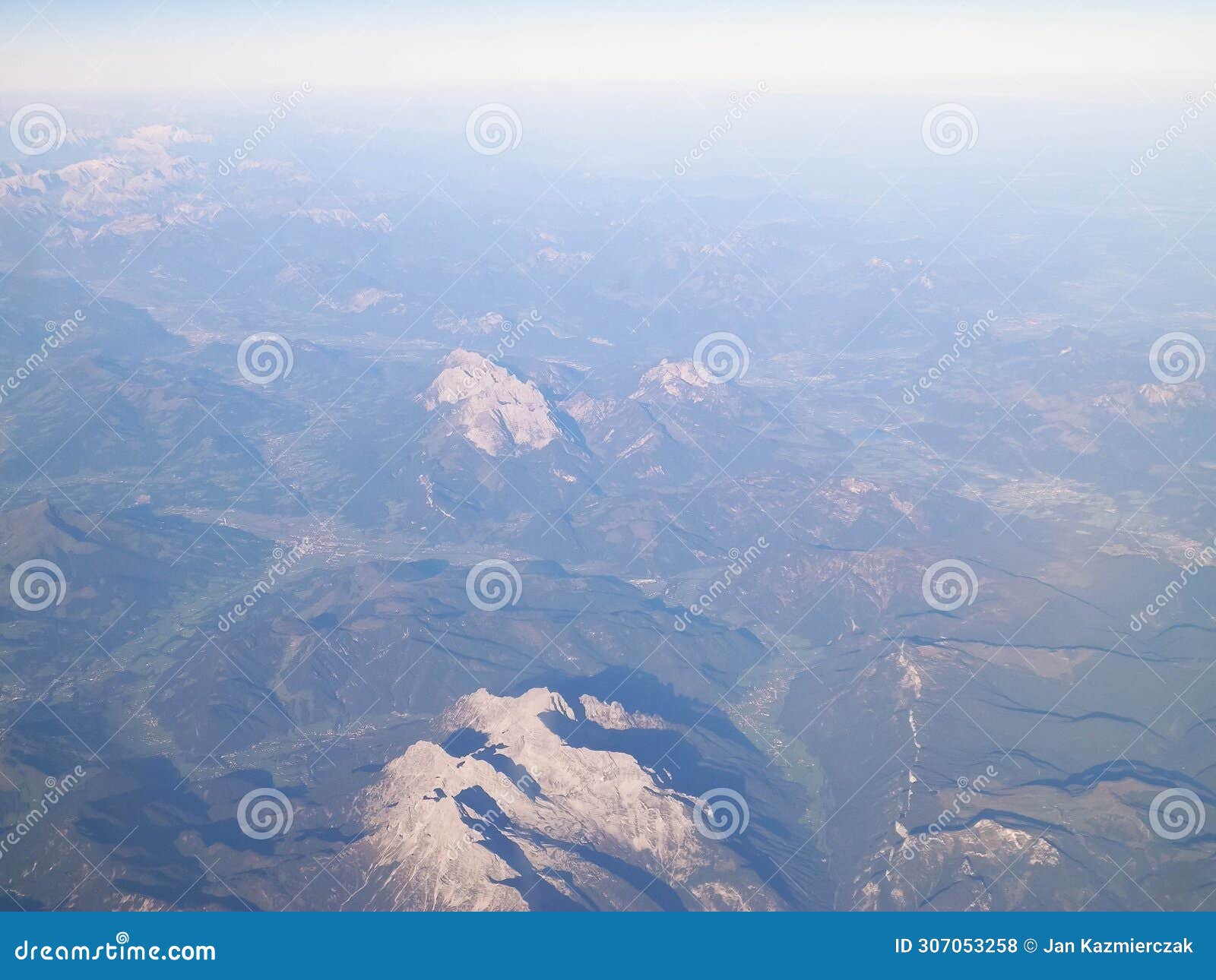 Alps from plane window stock photo. Image of environment - 307053258
