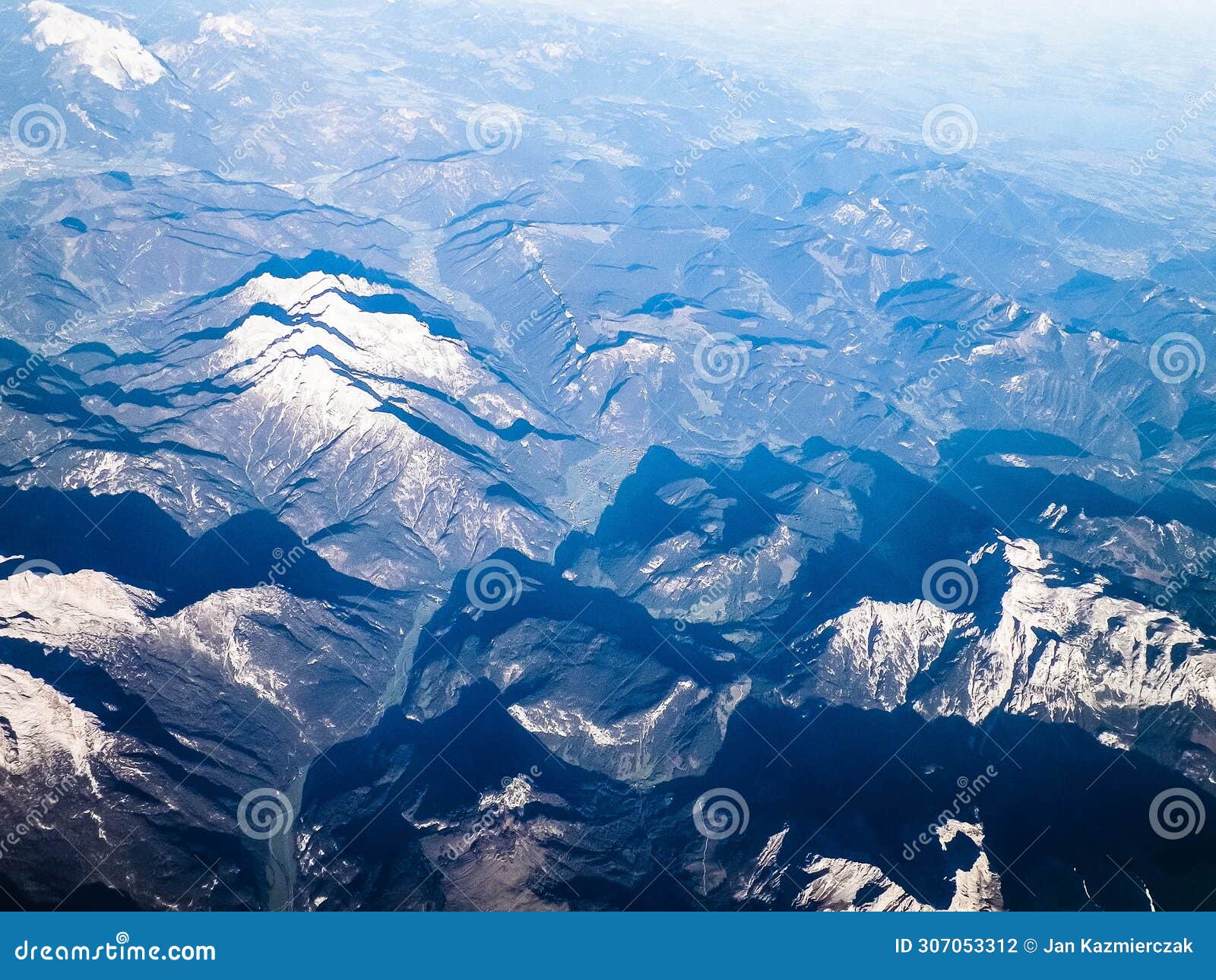 Alps from plane window stock photo. Image of europe - 307053312