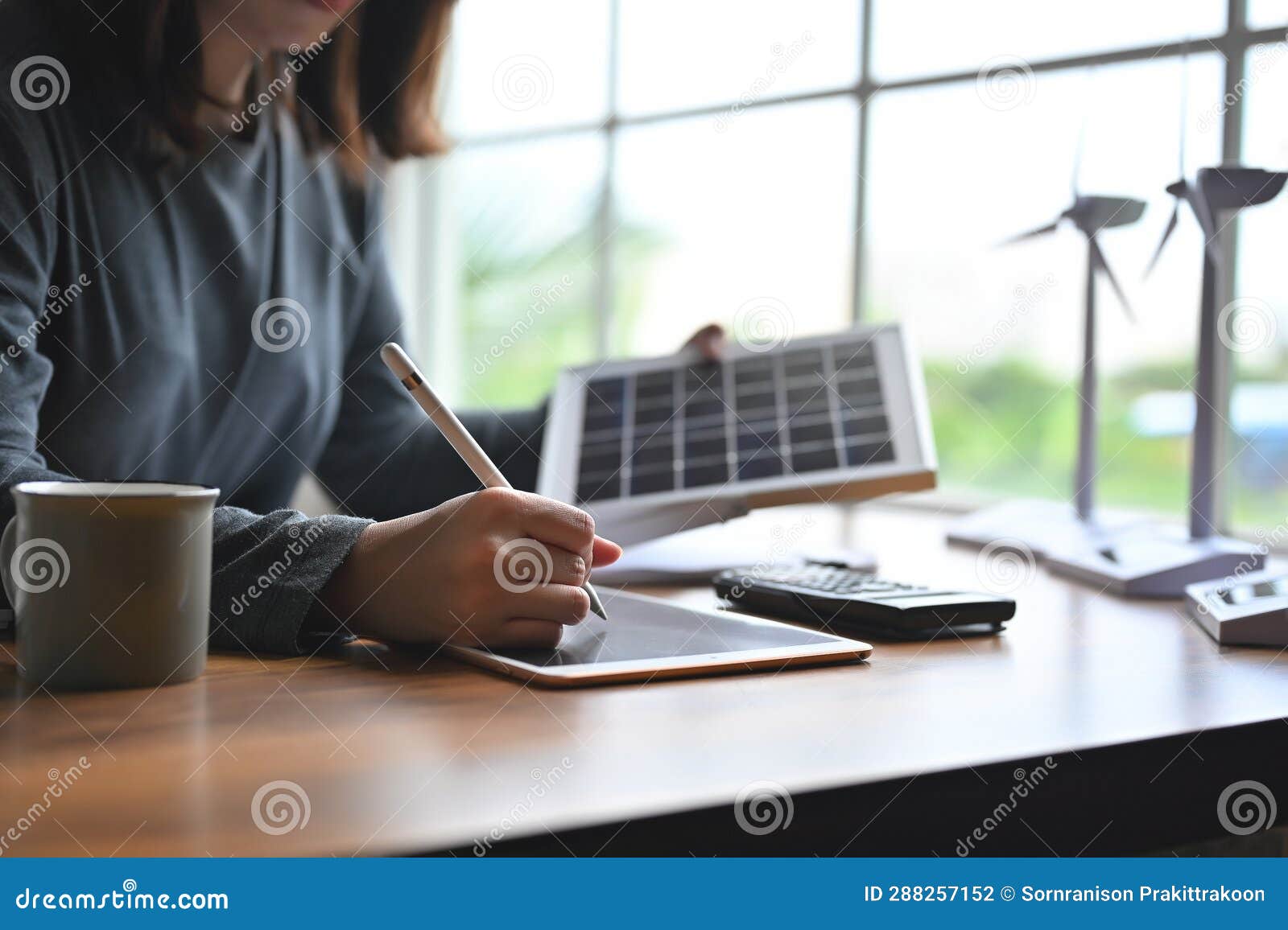 Alternative Energy Engineers Use Technology Tablet on Table for ...