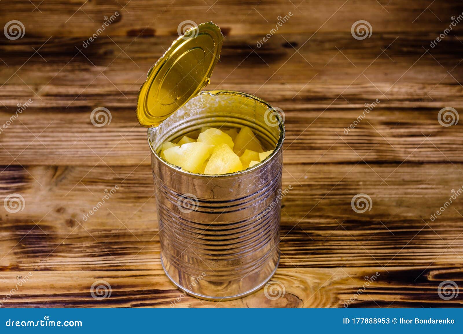 Aluminium Tin Can with Chopped Canned Pineapple on Wooden Table Stock ...