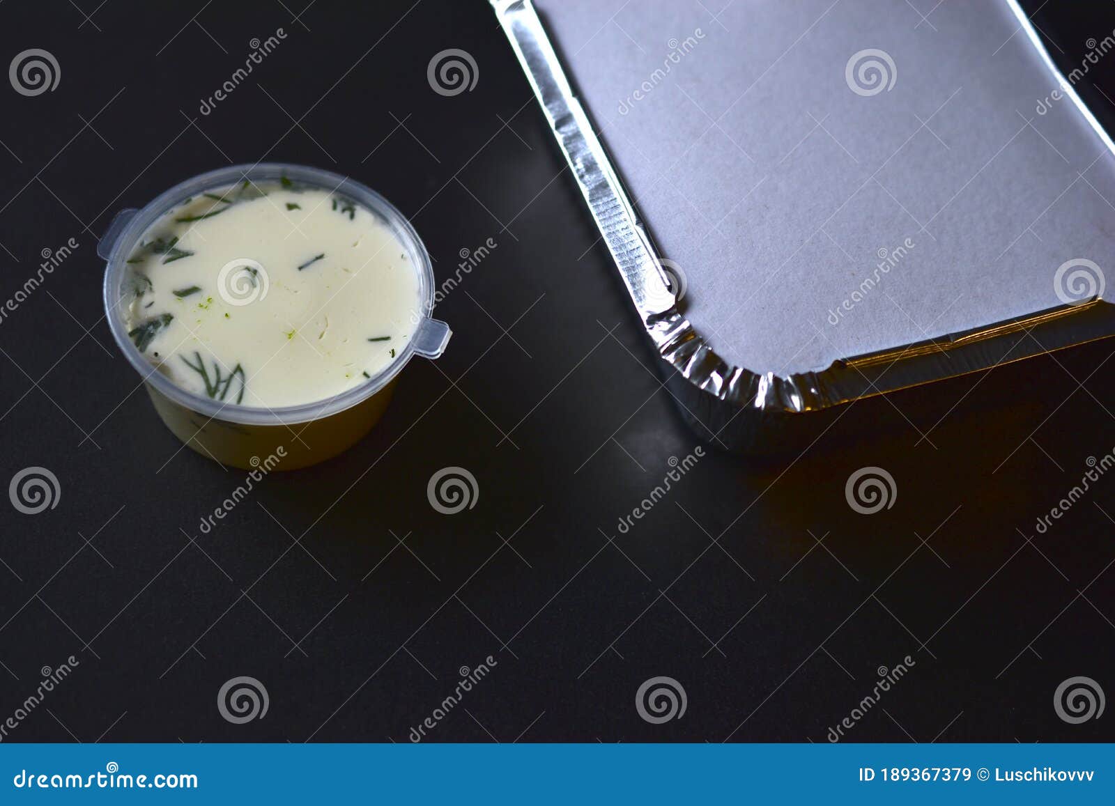 Aluminum Container with Food and White Sauce with a Jar Stock Image ...