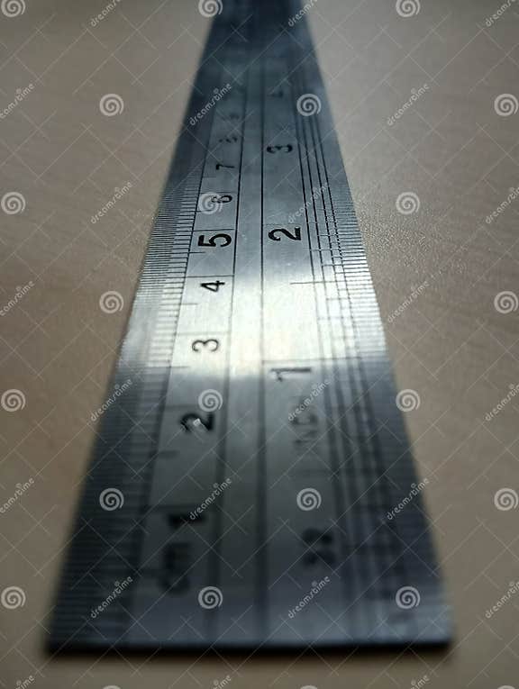 Aluminum Ruler on the Table Stock Photo - Image of 12345, ruler: 277749618