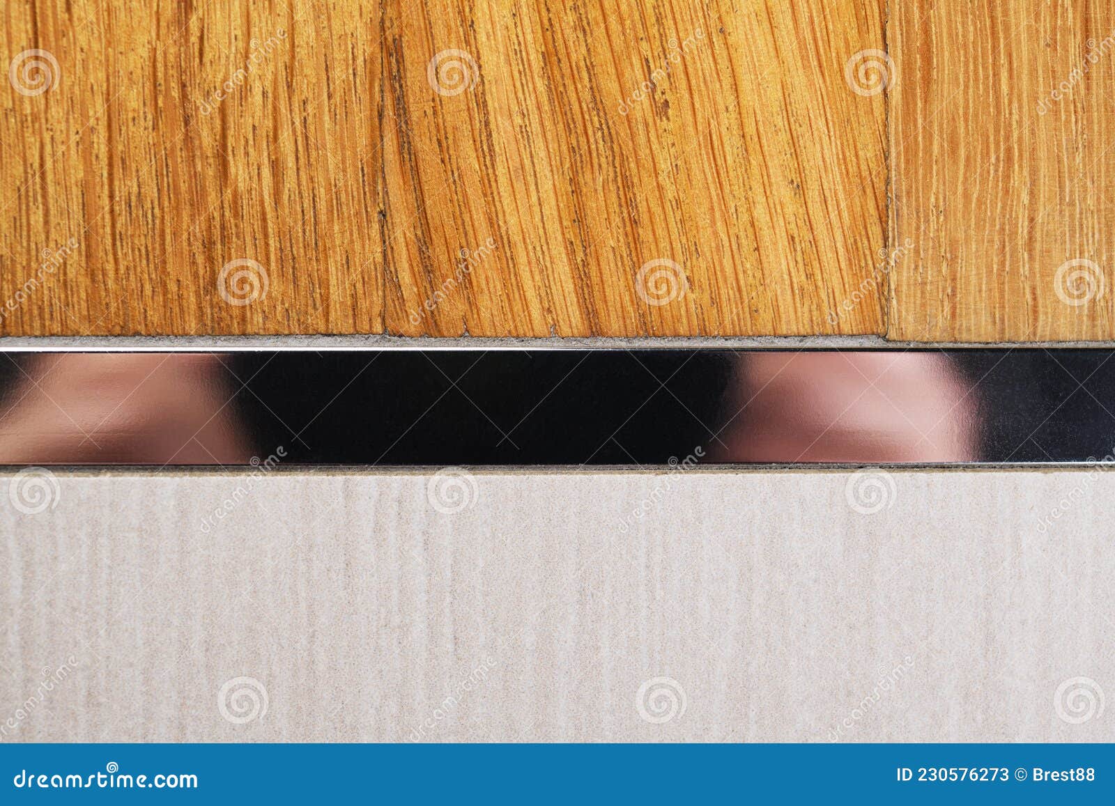 Aluminum Threshold between Ceramic Tiles and Parquet Stock Image ...