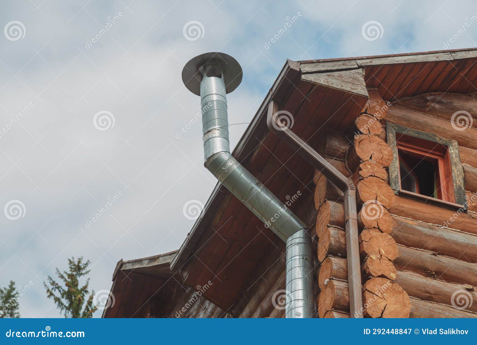 Aluminum Ventilation Pipe on the Log Wooden Facade of Building. Stock ...