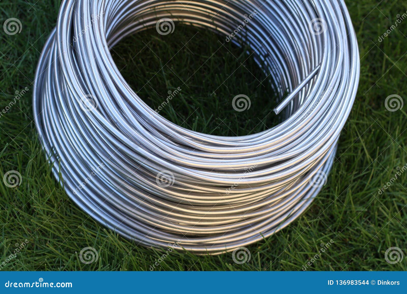 Aluminum Wire Coil on the Grass Stock Photo - Image of alms, canter ...