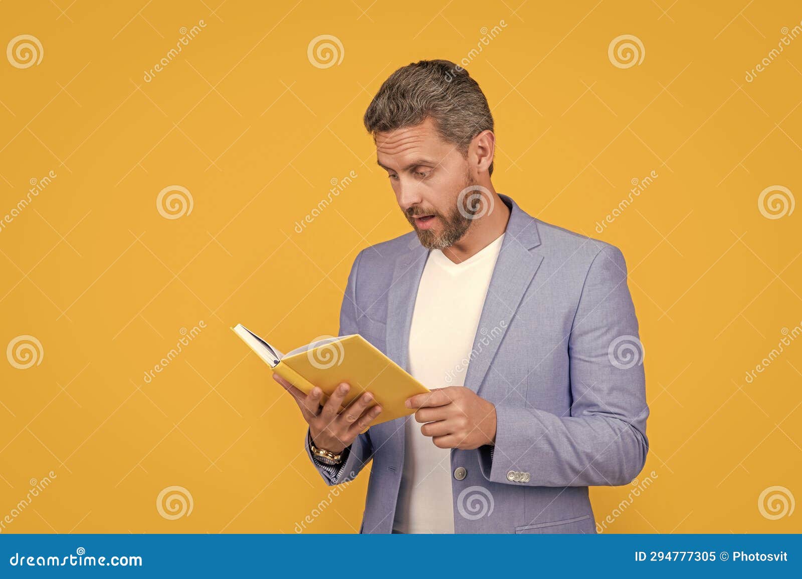 Amazed Man Reader Reading Book in Jacket. Studio Shot of Man Reader ...