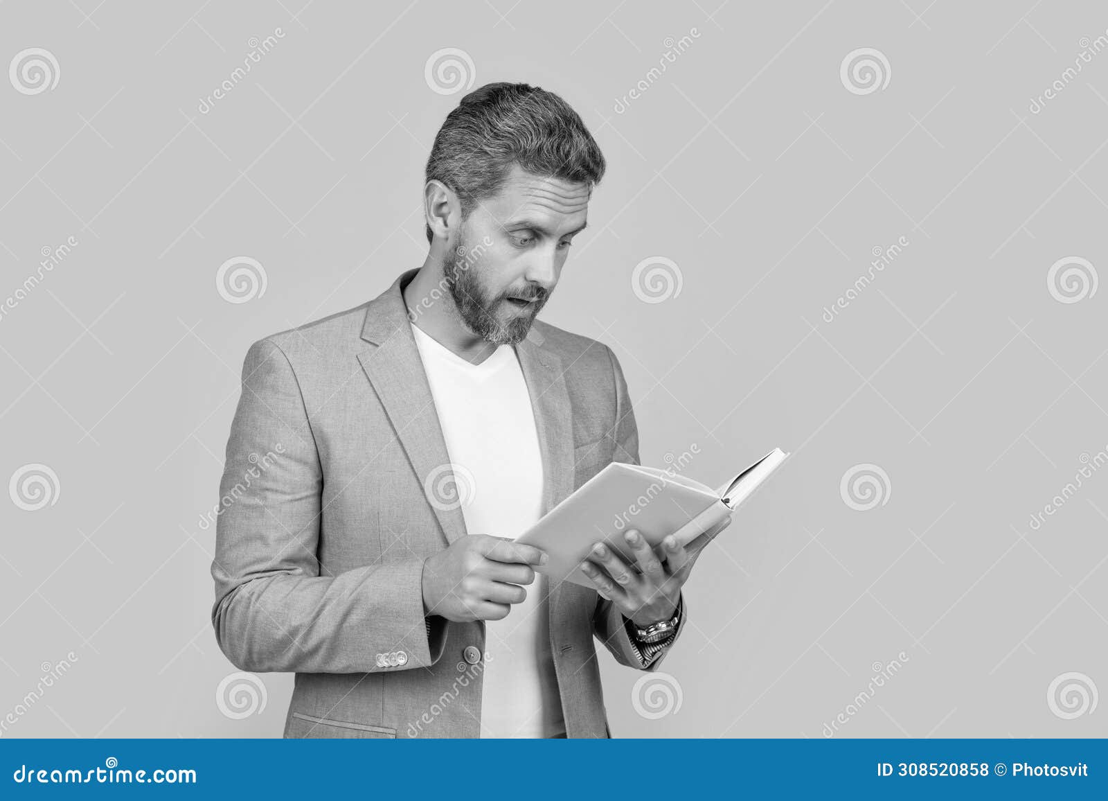 Amazed Man Reader Reading Book in Jacket. Studio Shot of Man Reader ...