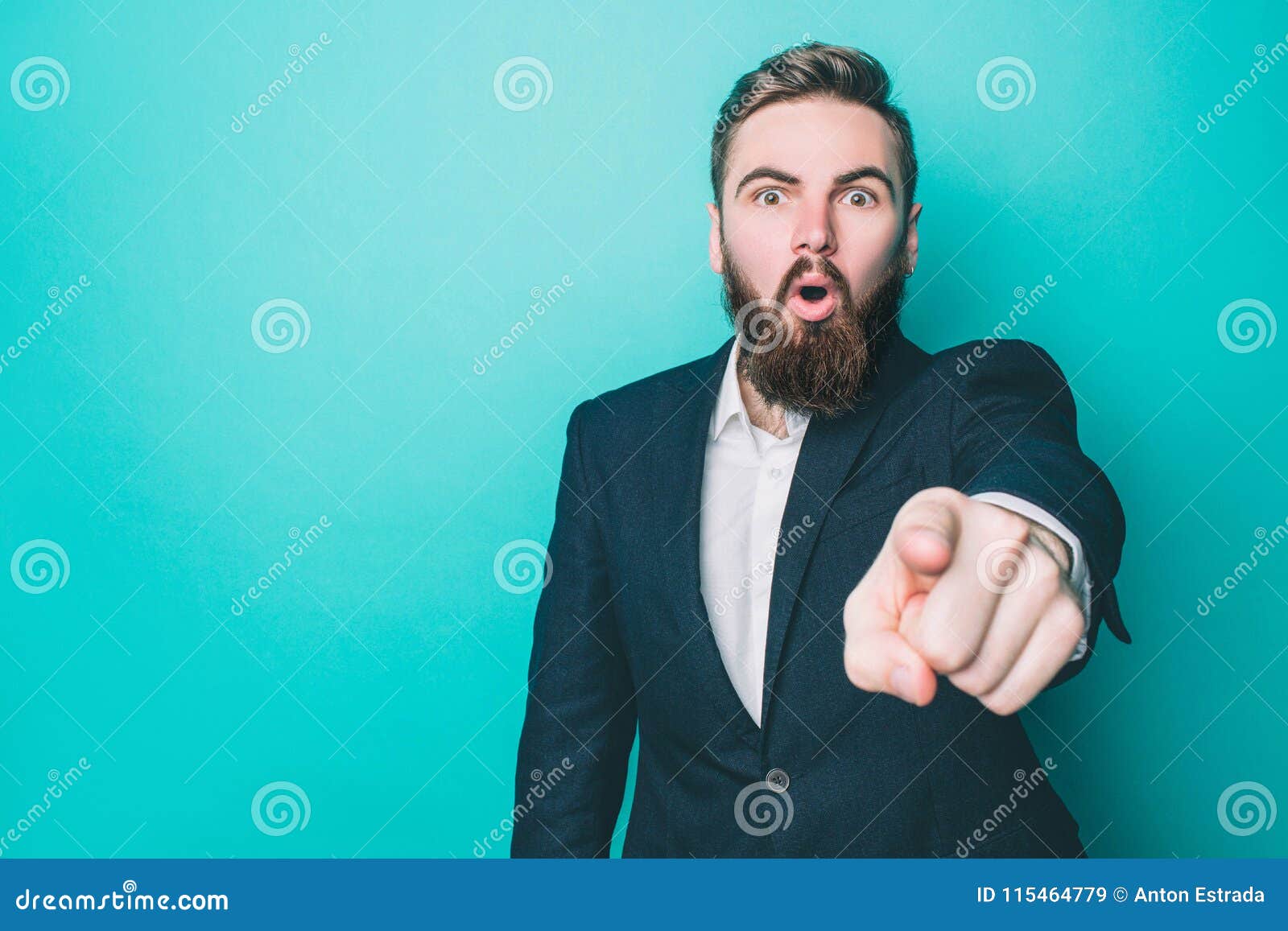 Amazed Man is Standing and Pointing on Camera. he is Looking Straight ...