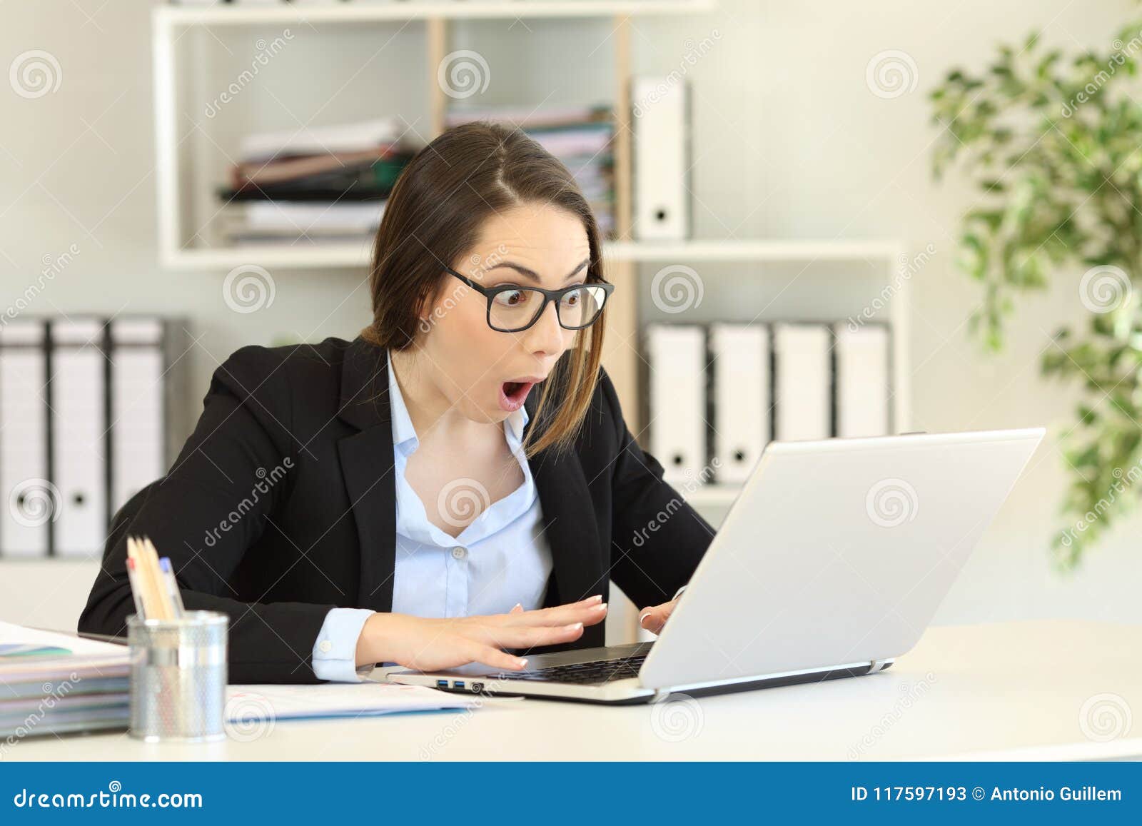 Amazed Office Worker Reading Good News in a Computer Stock Image ...