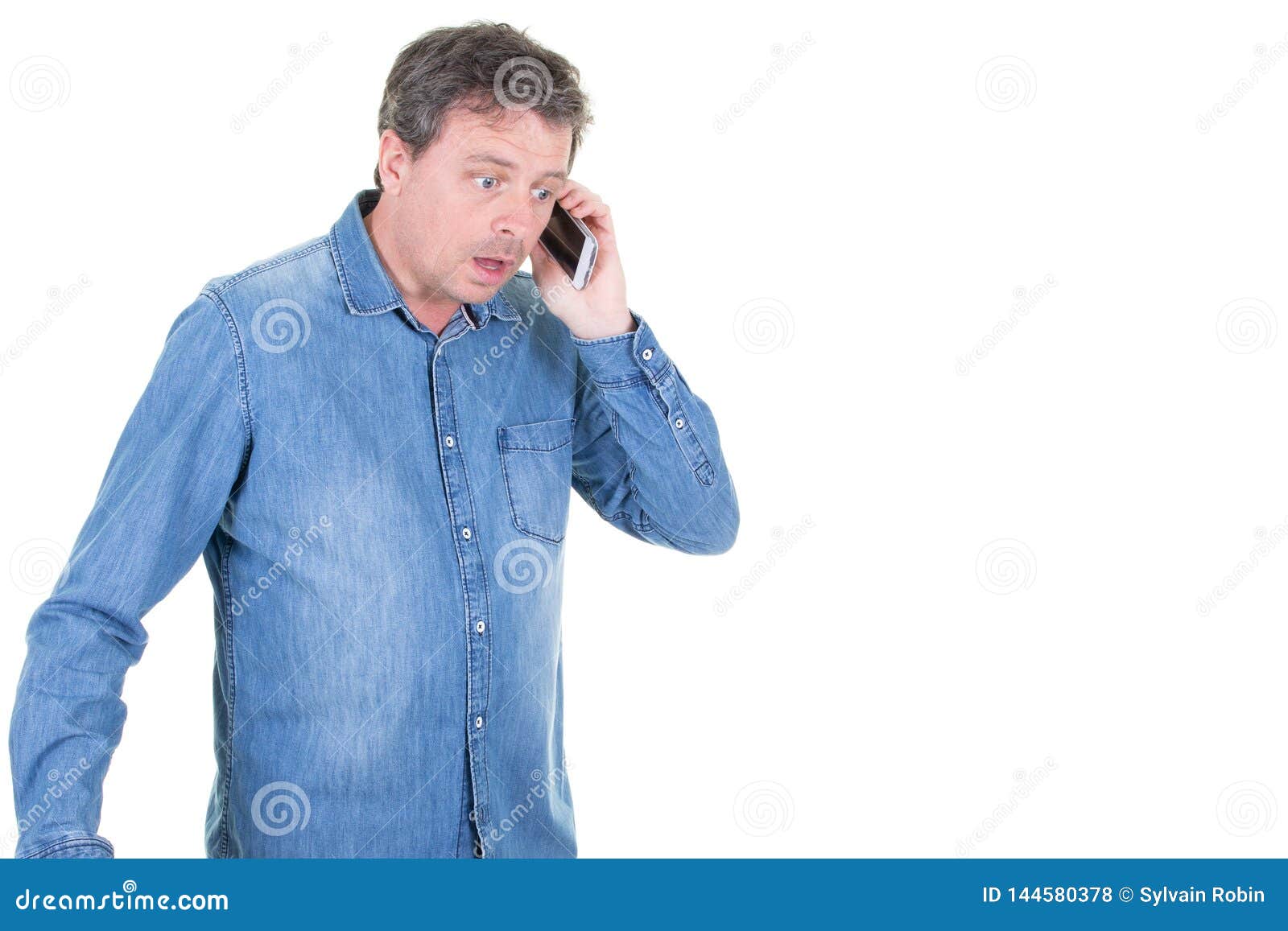 Amazed Surprised Amazed Man Looking Down Holding Phone in Copy Space ...