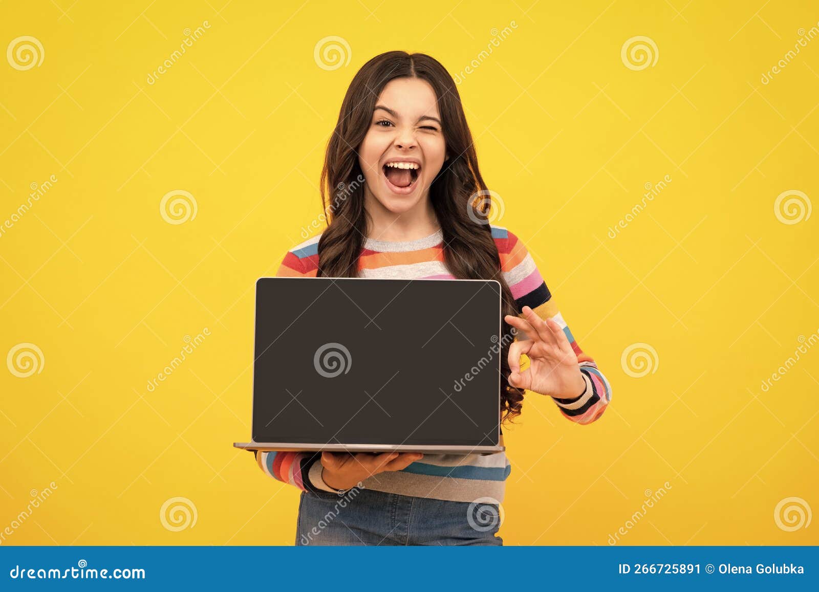 Amazed Teenager. Student School Girl With Laptop On Isolated Studio ... Amazed Teenager. Student School Girl With Laptop On Isolated Studio ...
