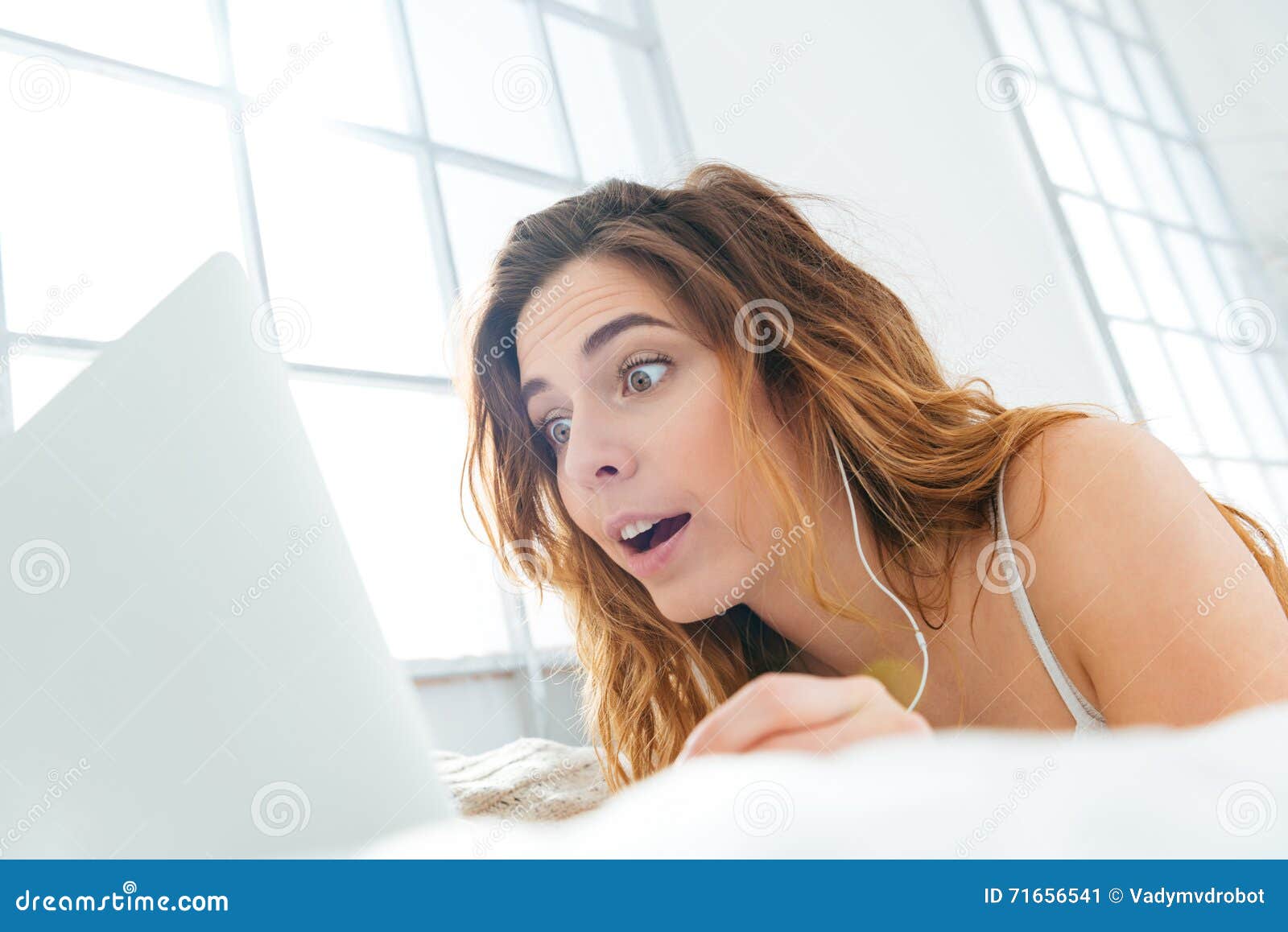 Amazed Woman Using Laptop Computer on the Bed Stock Image - Image of ...