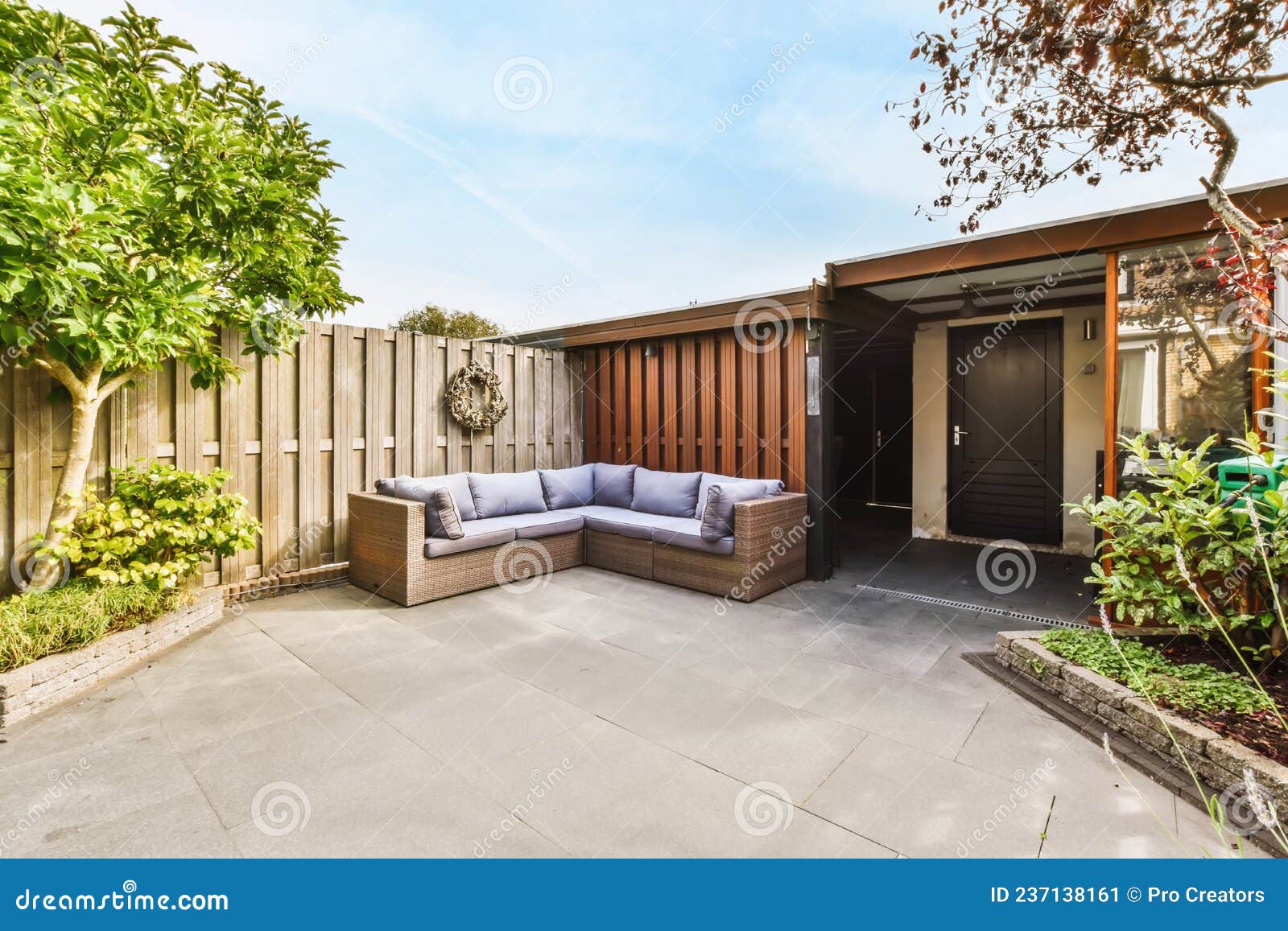 Amazing Courtyard Design with Wicker Sofas Stock Image - Image of real ...
