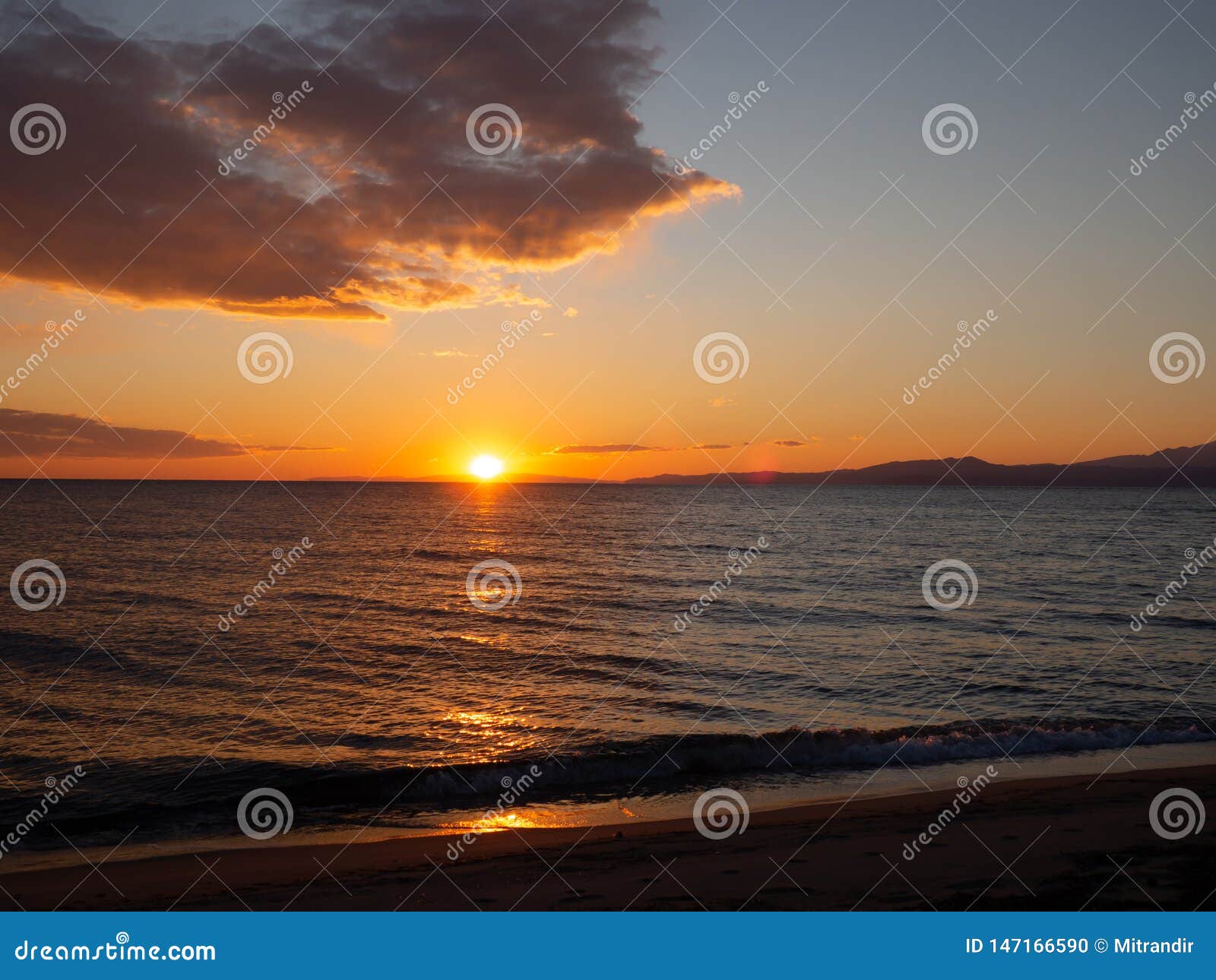 Amazing Orange Sunset on a Beautiful Empty Beach Stock Photo - Image of ...