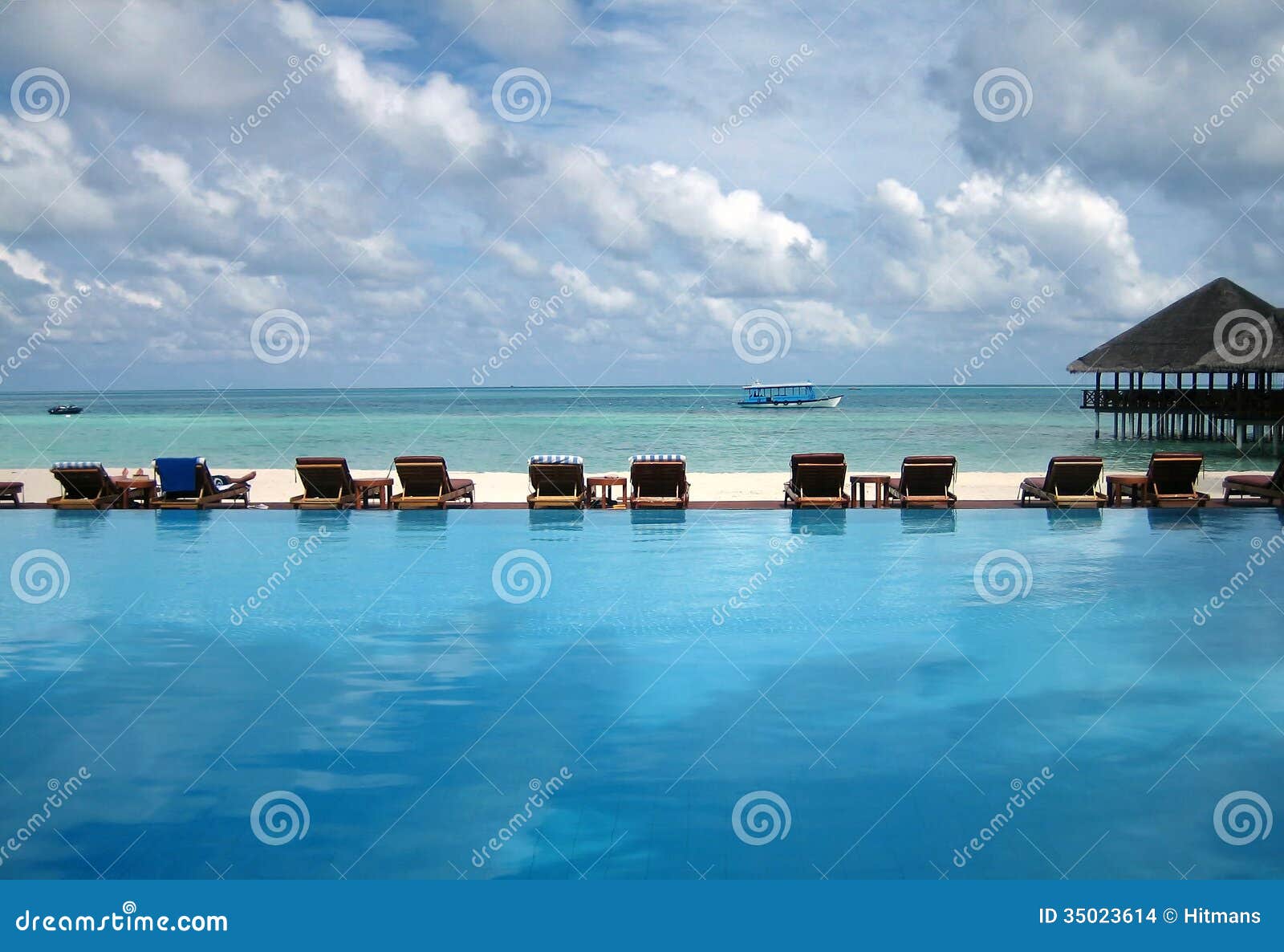 Amazing Pool and Deck Chairs Infront of Sea Stock Photo - Image of bora ...