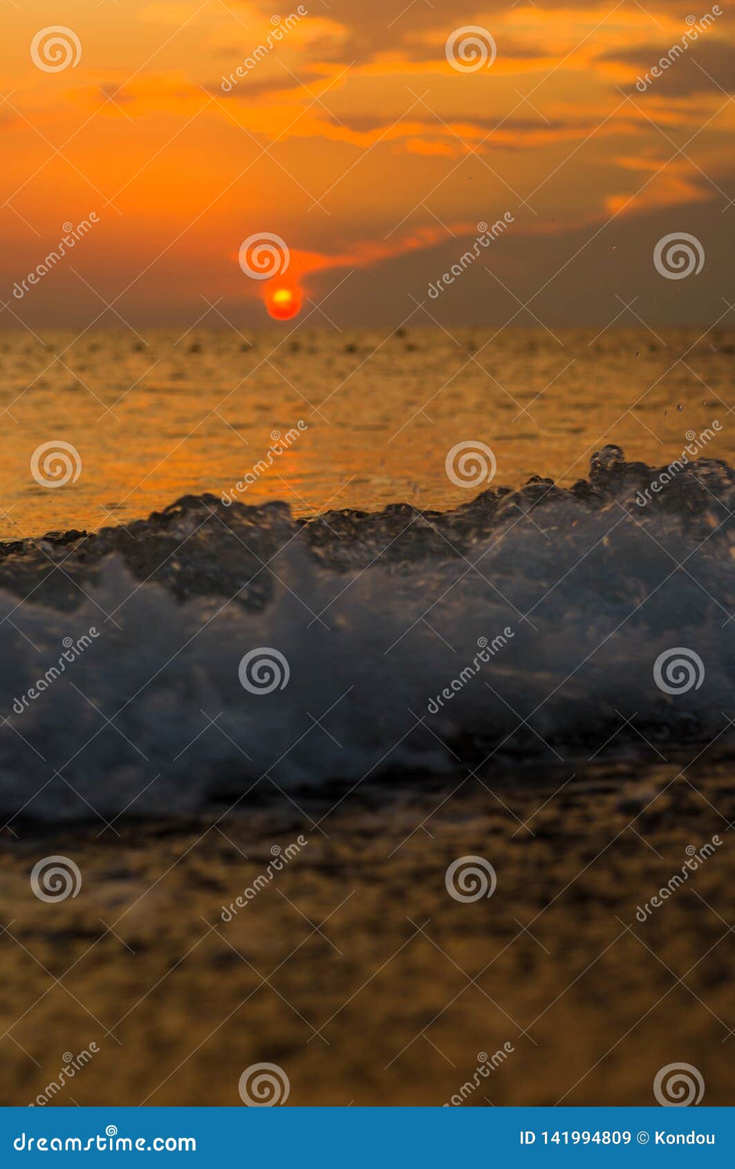 Amazing Sea Sunset on the Pebble Beach, the Sun, Waves, Clouds Stock ...