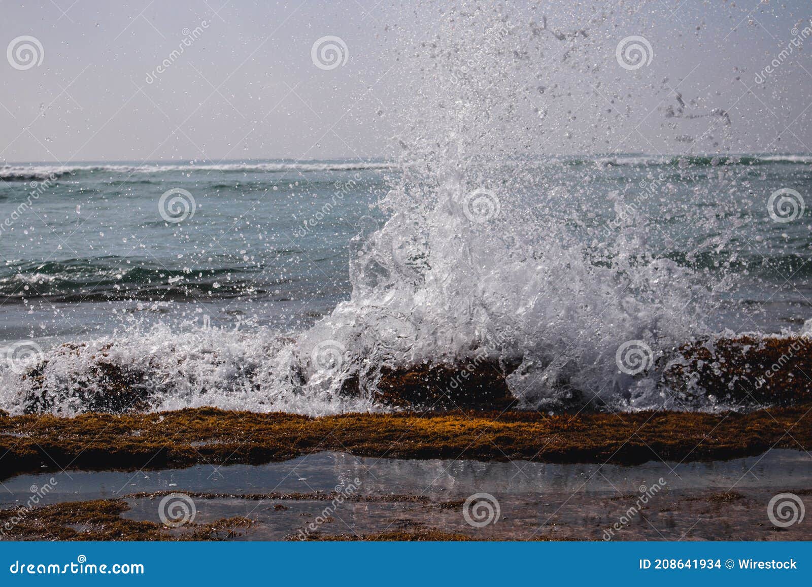 Amazing Shot of the Waves Splashing and Bouncing on the Rocks of the ...