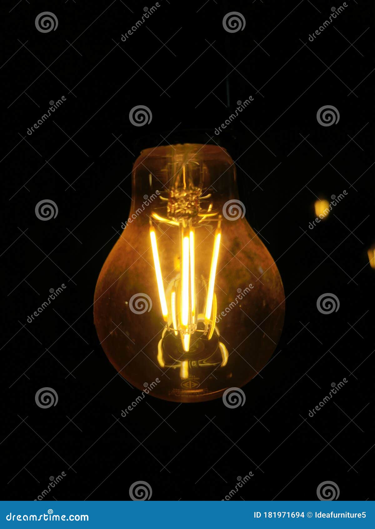 Electricity Current Inside a Retro Crystal Clear Light Bulb. Stock ...