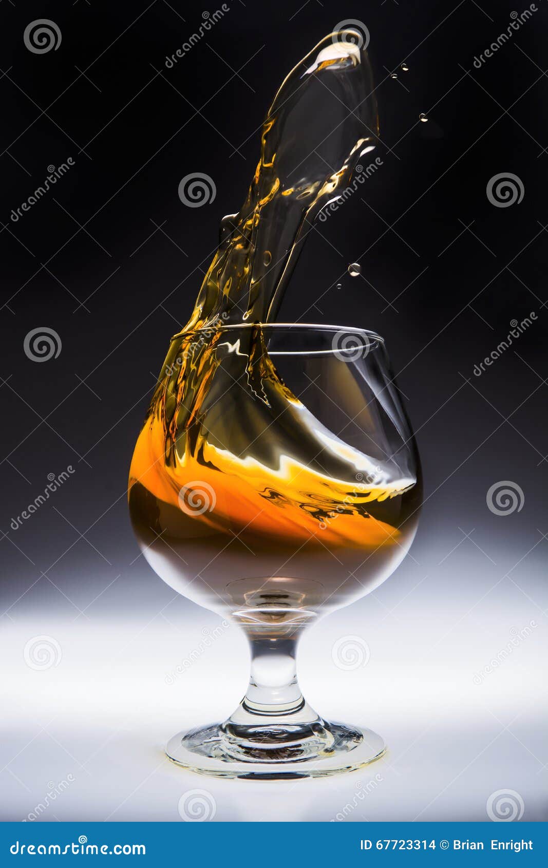 Amber Alcohol Drink Splash in Glass Stock Photo - Image of cognac ...
